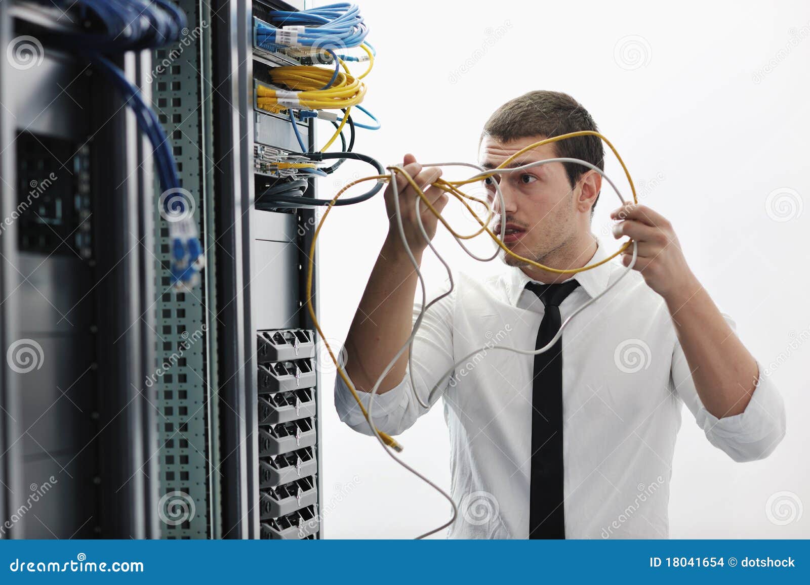 Young It Engeneer In Datacenter Server Room Picture. Image: 18041654