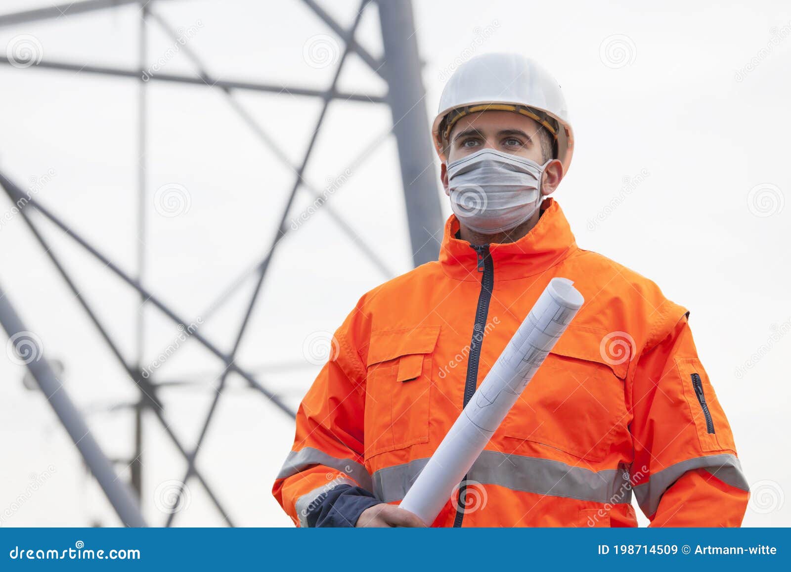 Young Engineer or Architect with Face Mask and Plan in His Hand on ...