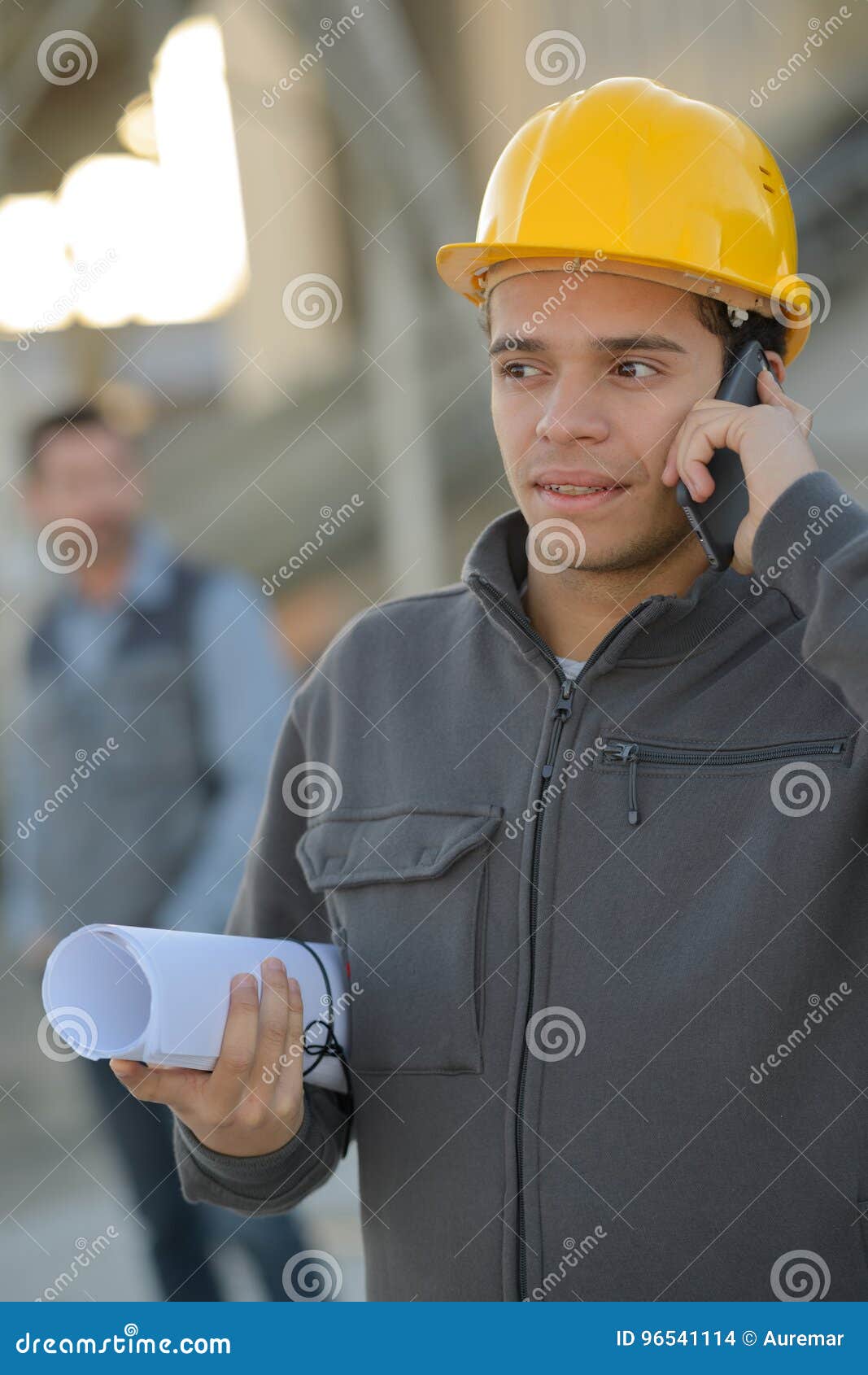 Young engineer on call stock photo. Image of location - 96541114