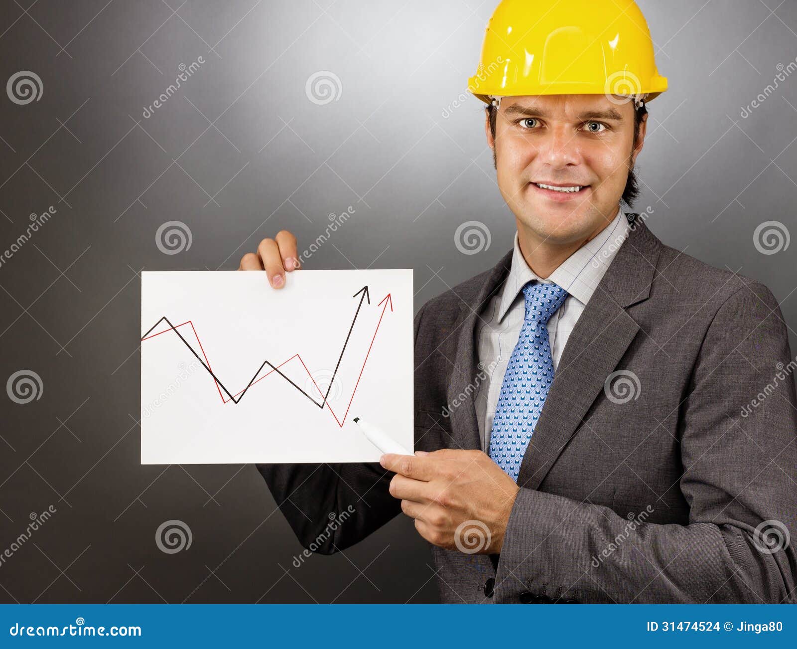 Young Engineer Drawing a Rising Graph, Representing Business Growth ...