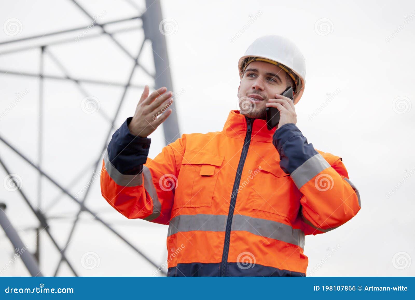 Young Engineer or Foreman Talking on Smart Phone on a Oil Platform or ...