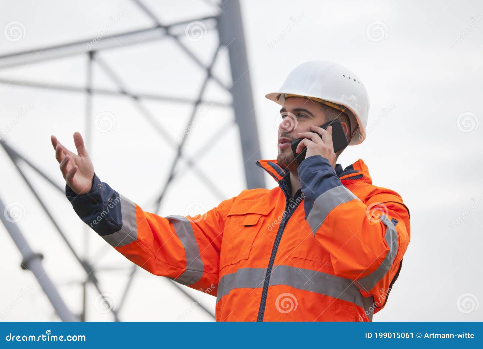Young Engineer or Foreman Talking on Smart Phone on a Oil Platform or ...