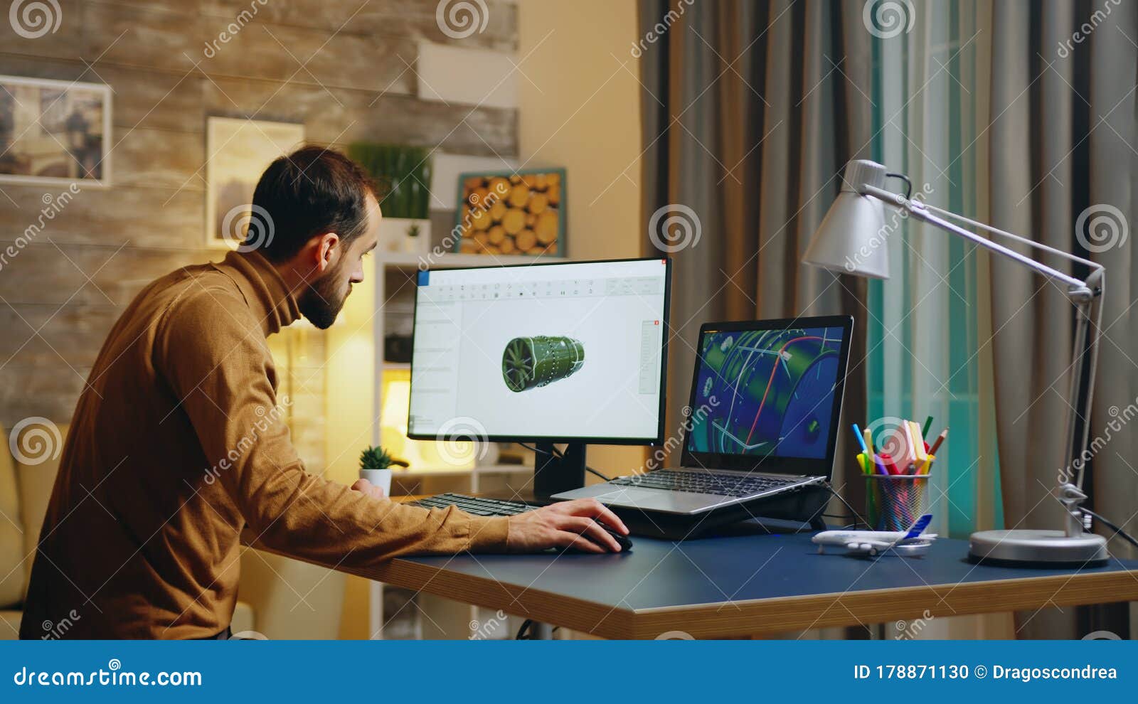 Young Engineer in His Home Office Working on Developing a New Turbine ...
