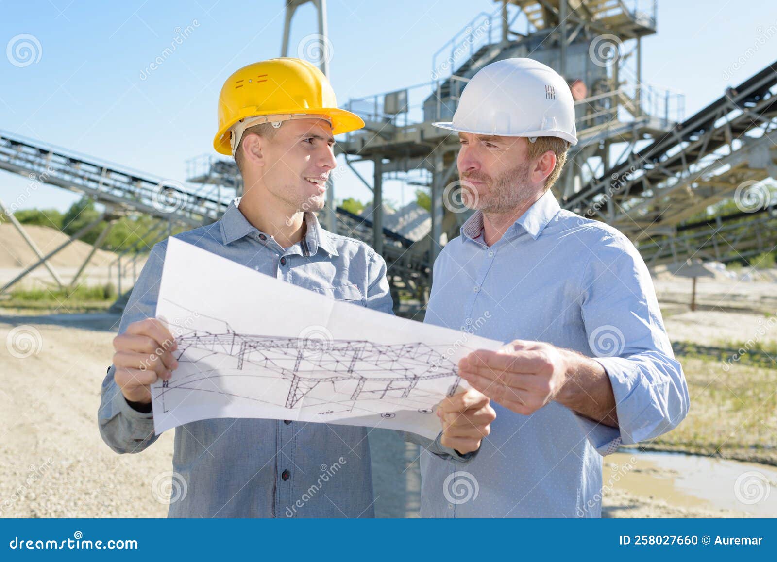 Young Engineer Holding Blueprint Structure Frame Stock Photo - Image of ...