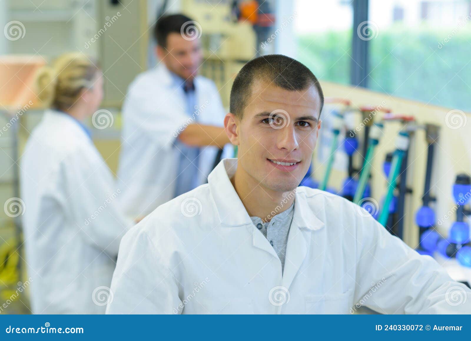 Young Engineer in Lab Coats Working in Factory Stock Photo - Image of ...