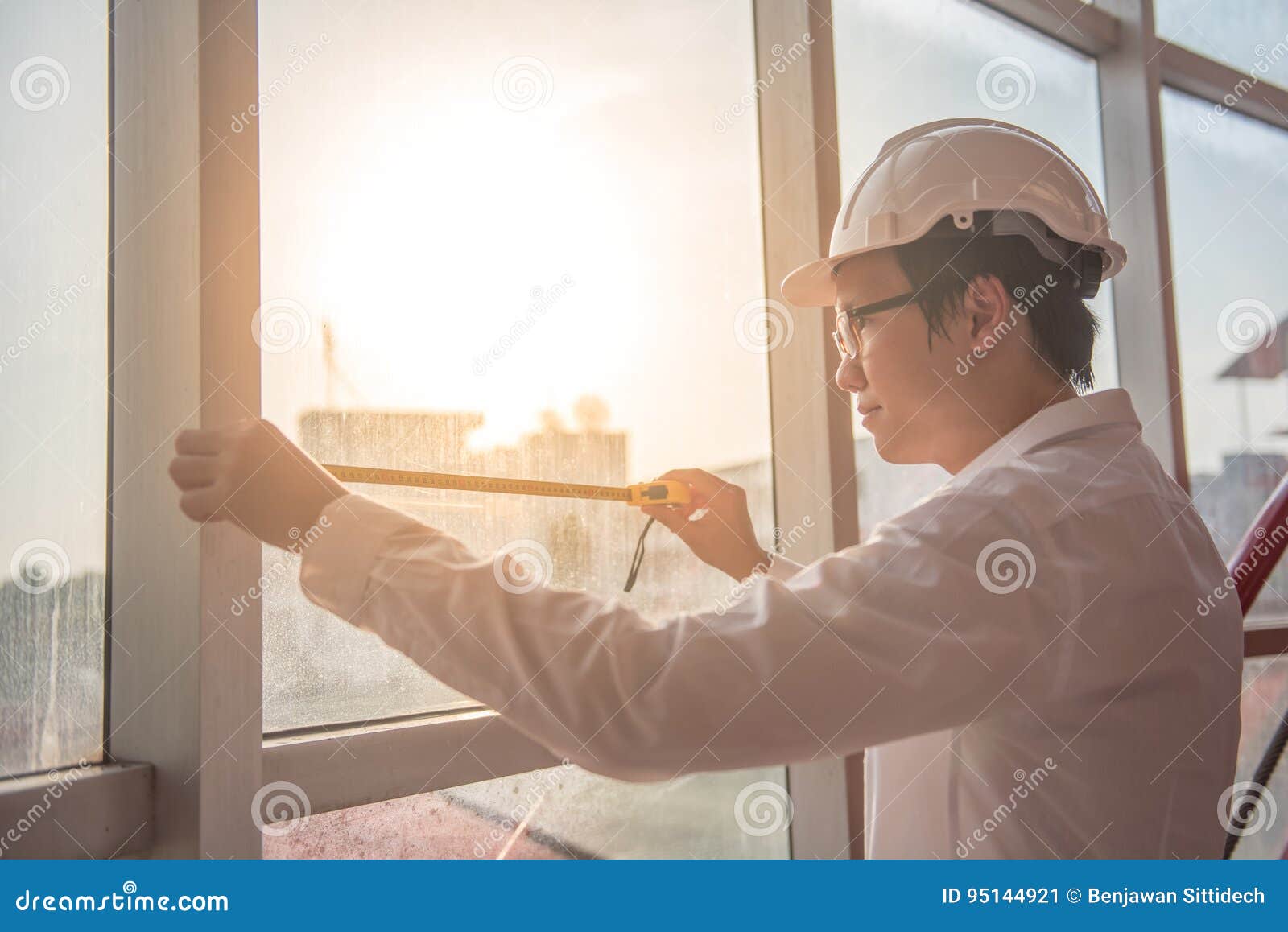 Young Engineer Man Using Measure Tape on Window Frame Stock Image ...