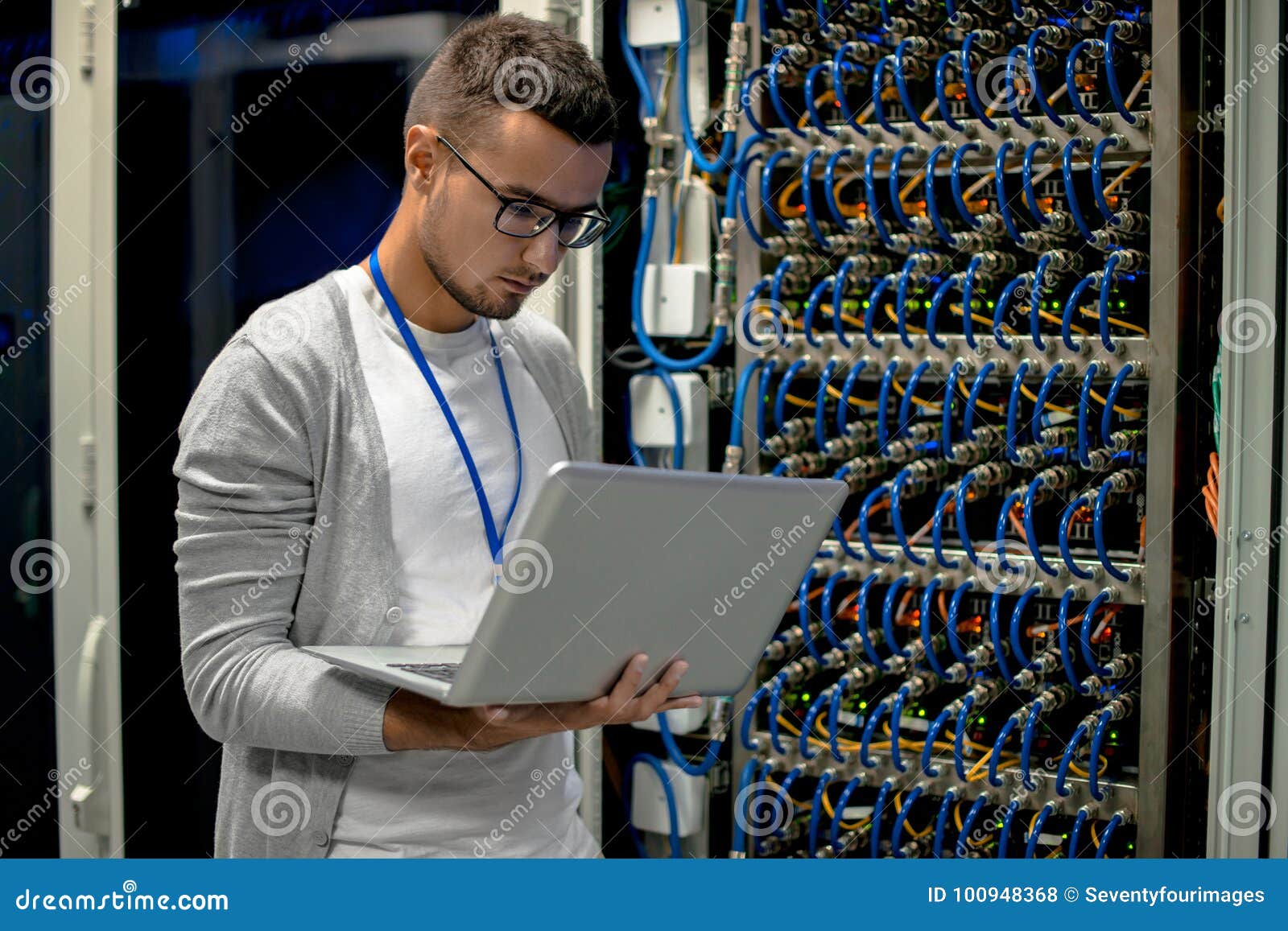 Young Engineer Managing Supercomputer Servers Stock Photo - Image of ...