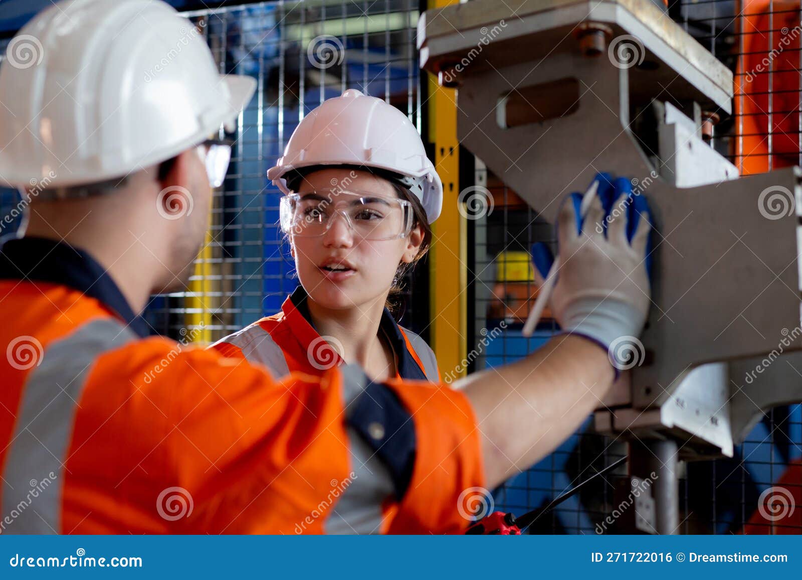 Young Engineer Man and Woman Talking and Explaining about Robot Arms ...