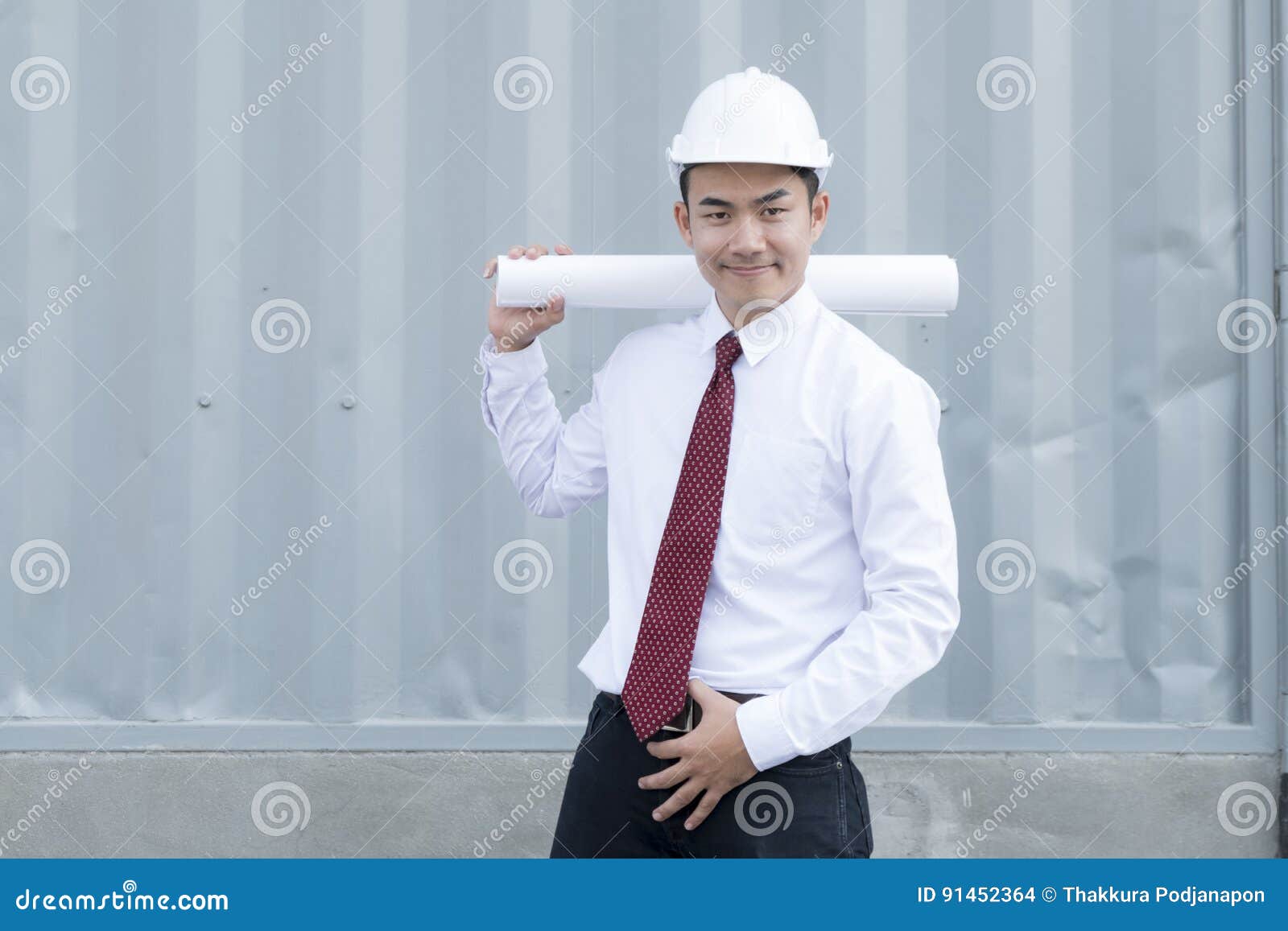 Young Engineer with Paper Plans. Stock Photo - Image of housing, design ...