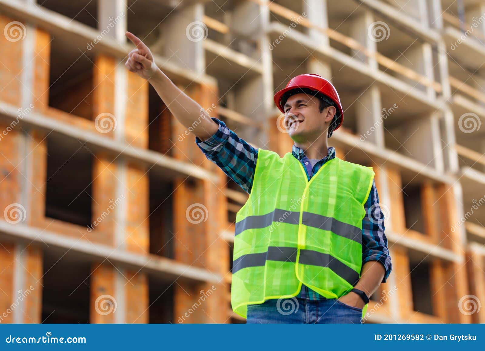 Young Engineer Showing Something at Building Site Stock Photo - Image ...