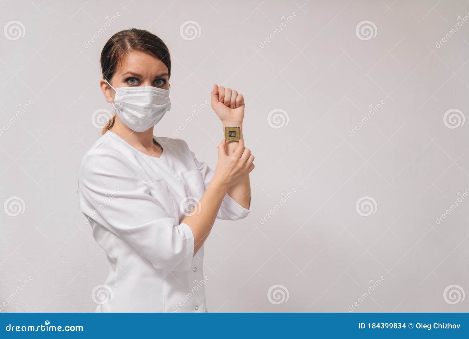 A Young Engineer Shows How To Use a Microchip with Data. the Concept ...