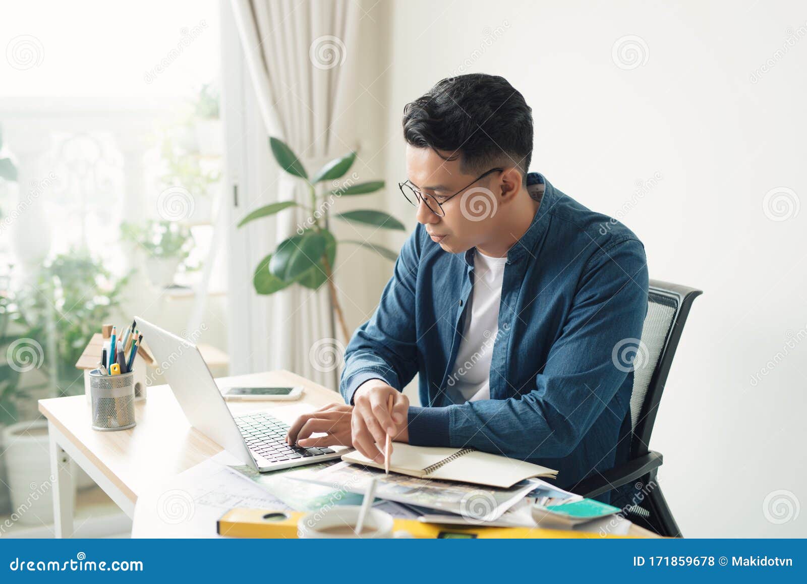 Young Engineer. Successful Busy Man Drawing Something while Working in ...