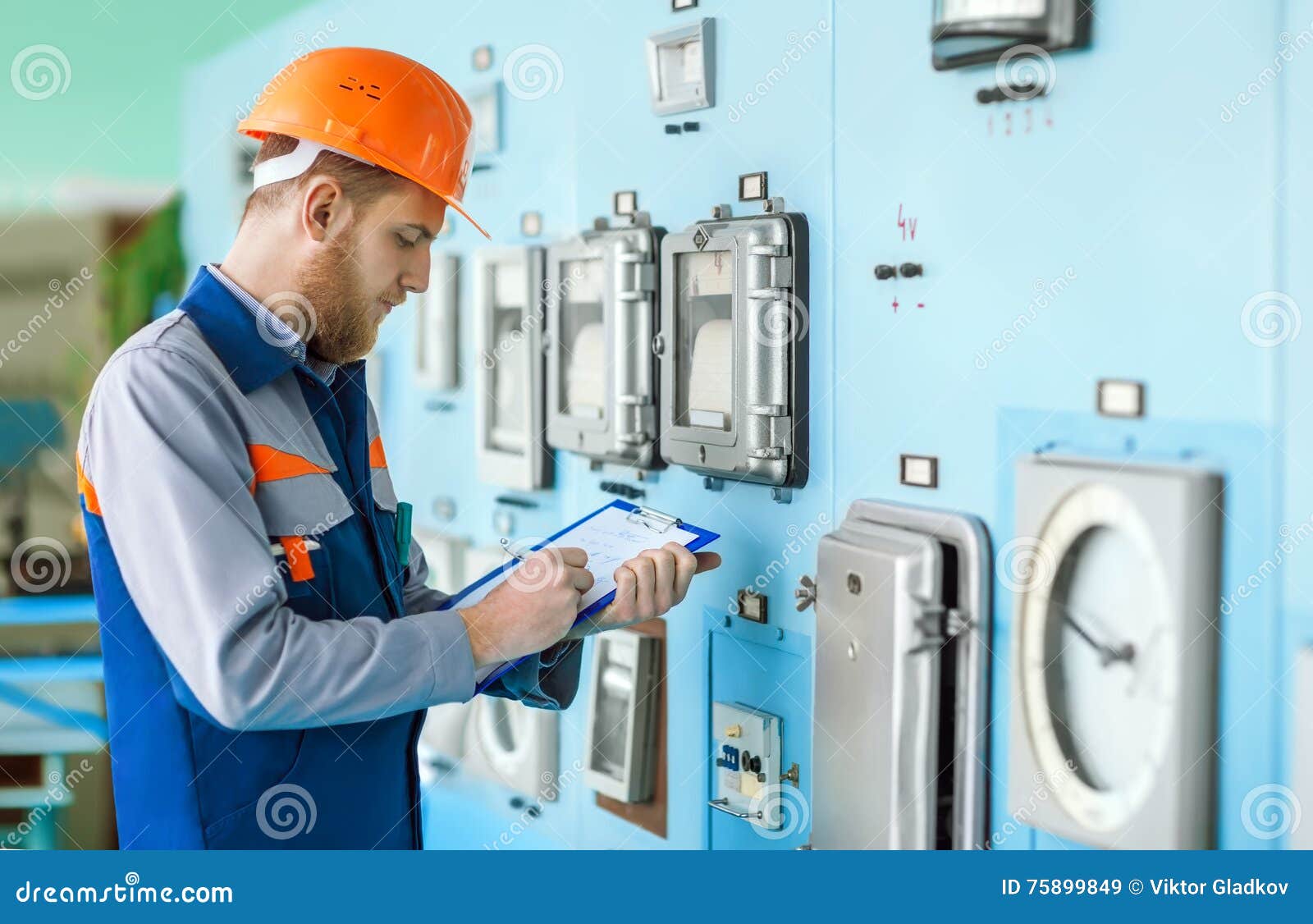 Young Engineer Taking Notes at Control Room Stock Image - Image of gear ...