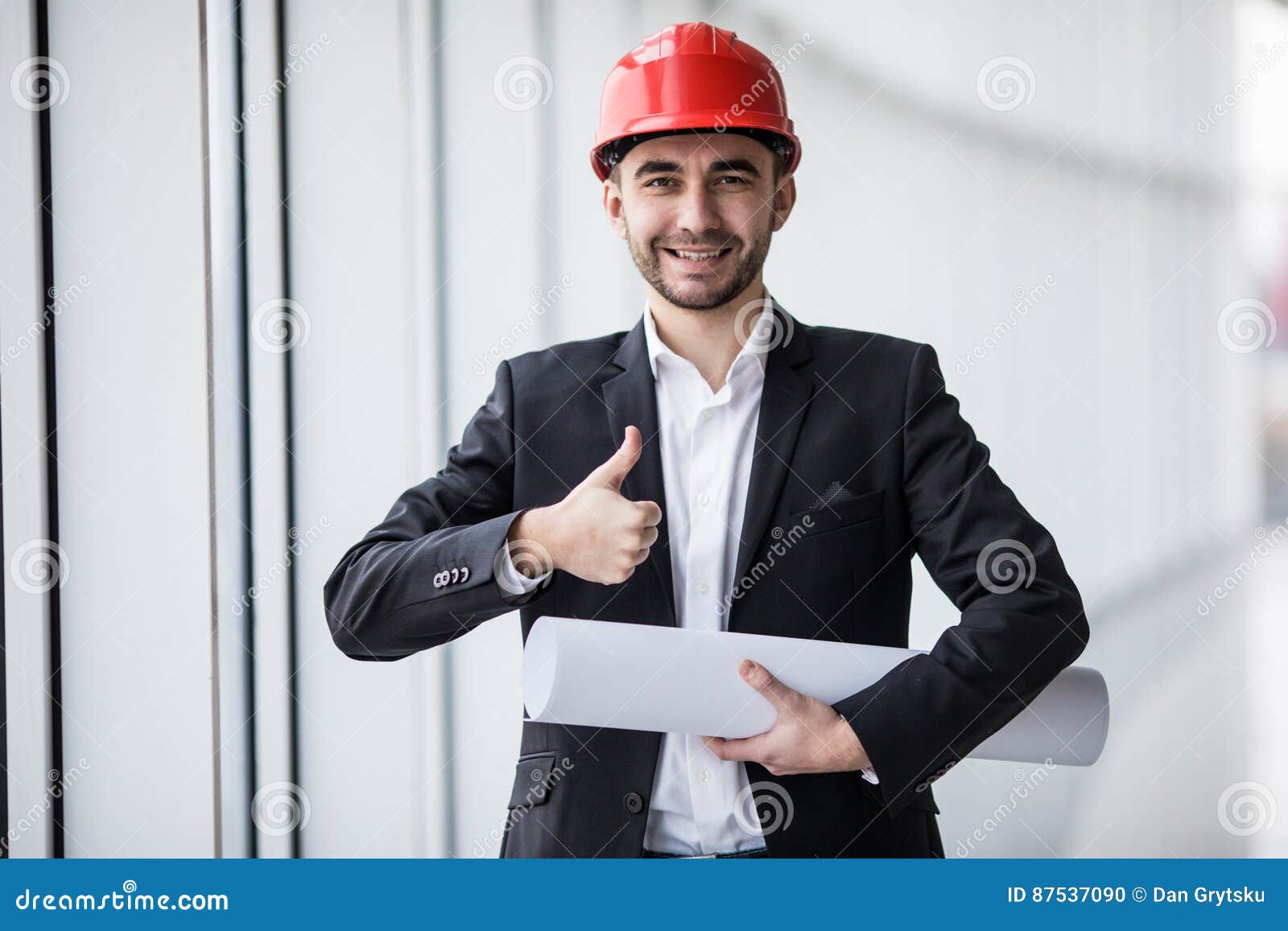 Young Engineer with Thumbs Up Indoors Near Panoramic Windows Stock ...