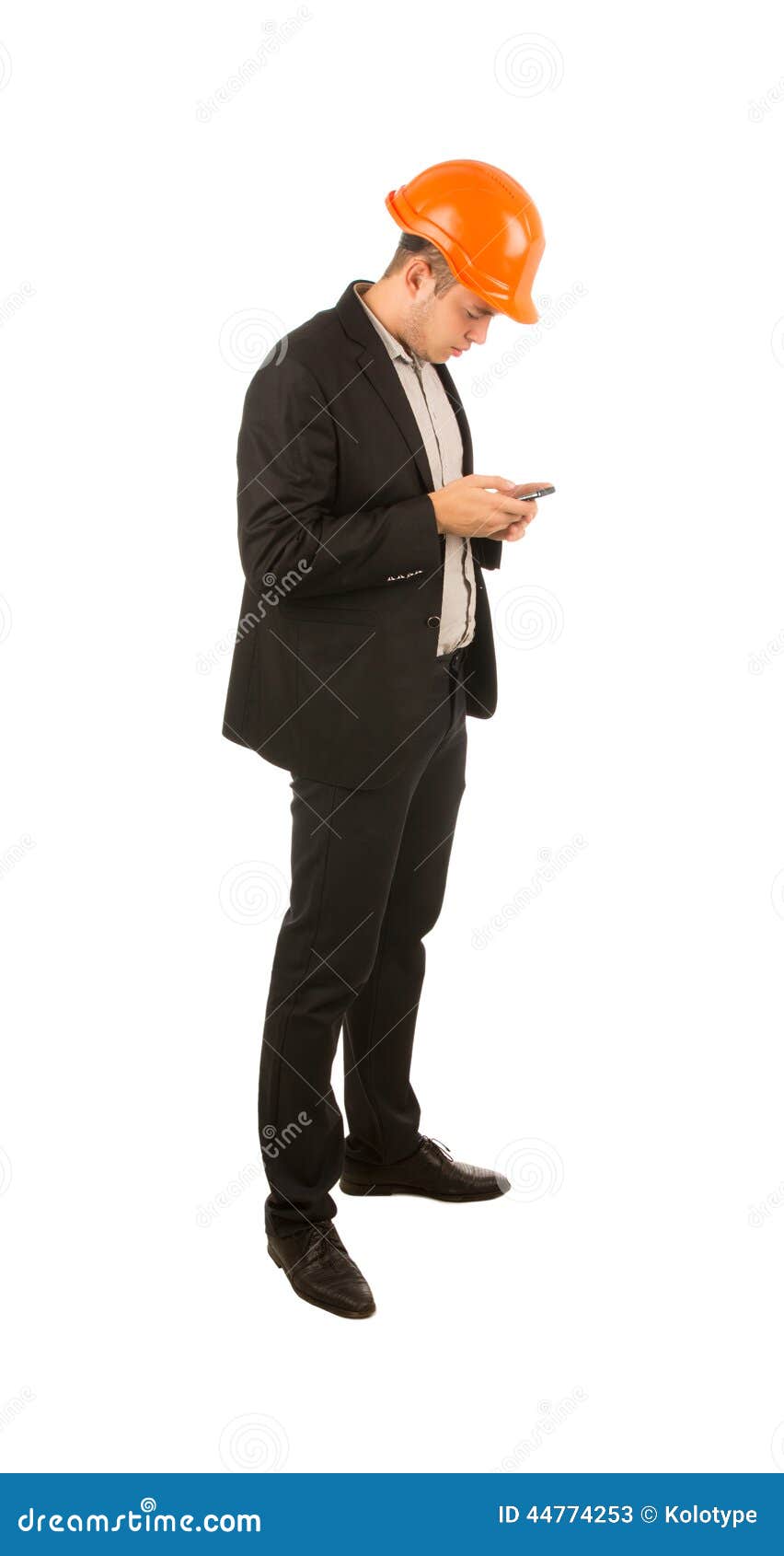 Young Engineer Using His Mobile Phone To Text Stock Image - Image of ...