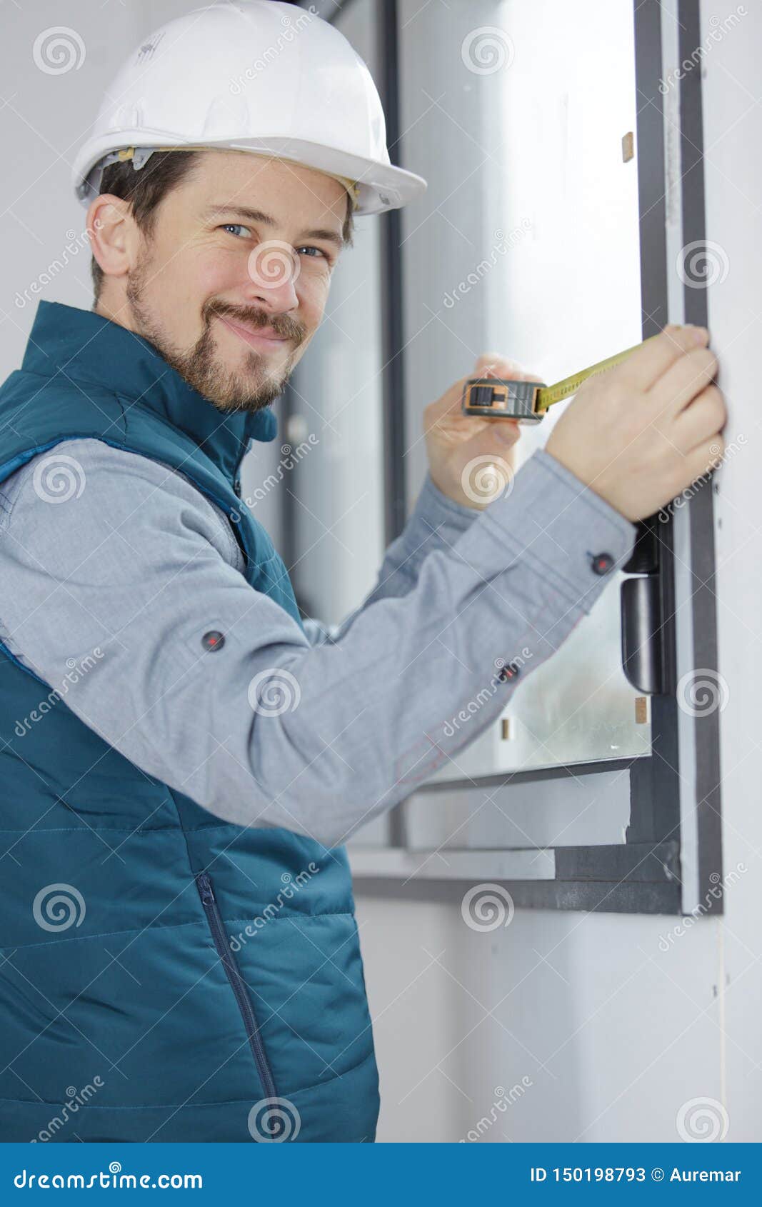 Young Engineer Using Tape Measure for Measuring Window at Site Stock ...