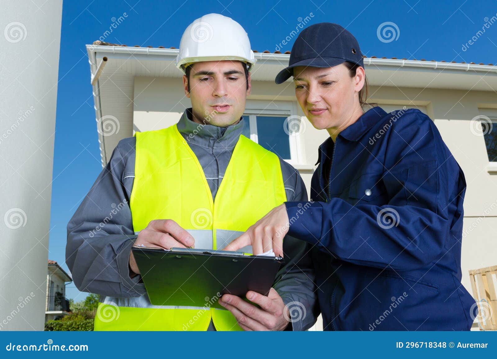 Young Engineer and Woman Outdoors Building Construction in Buildings ...