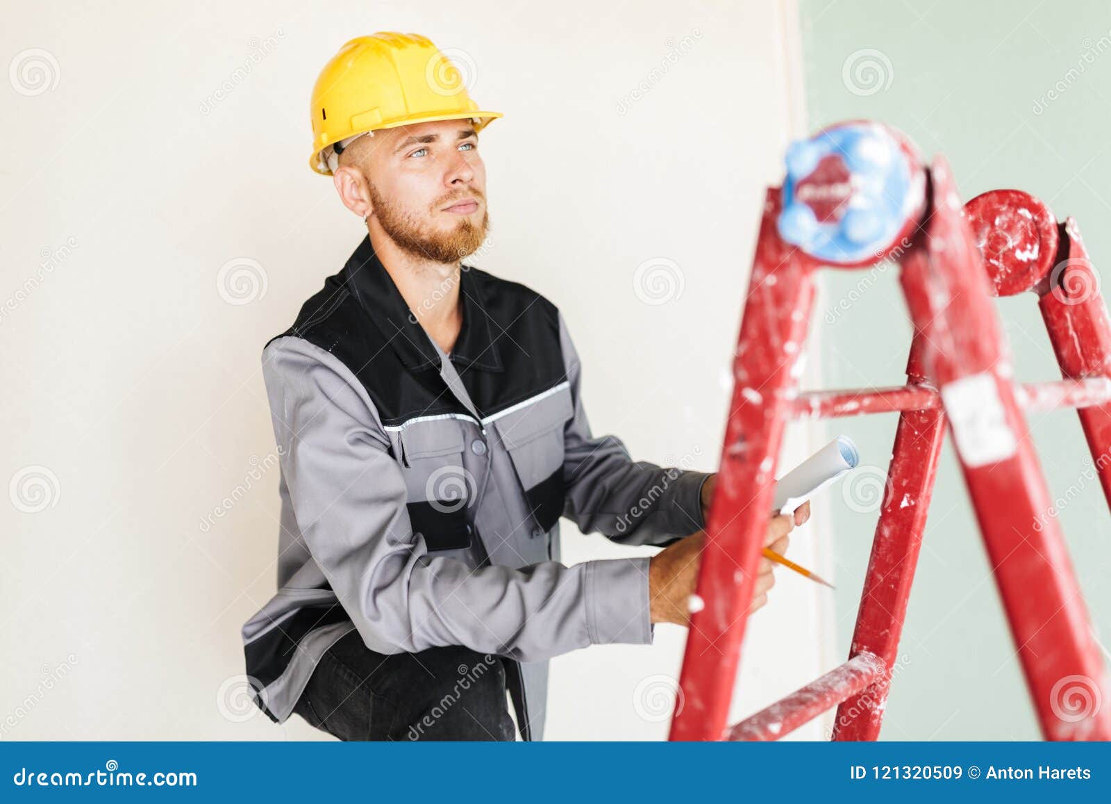 Young Engineer in Work Clothes and Yellow Hardhat Thoughtfully L Stock ...
