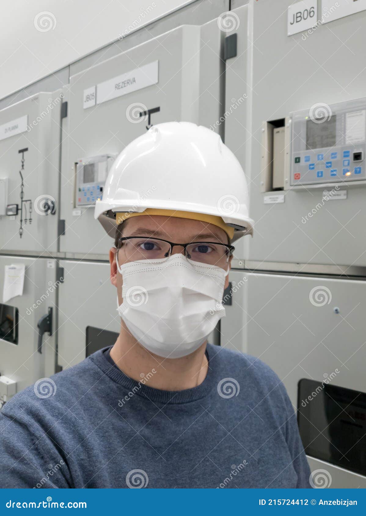 Young Engineer Working in Electrical Substation Wearing a Face Mask ...