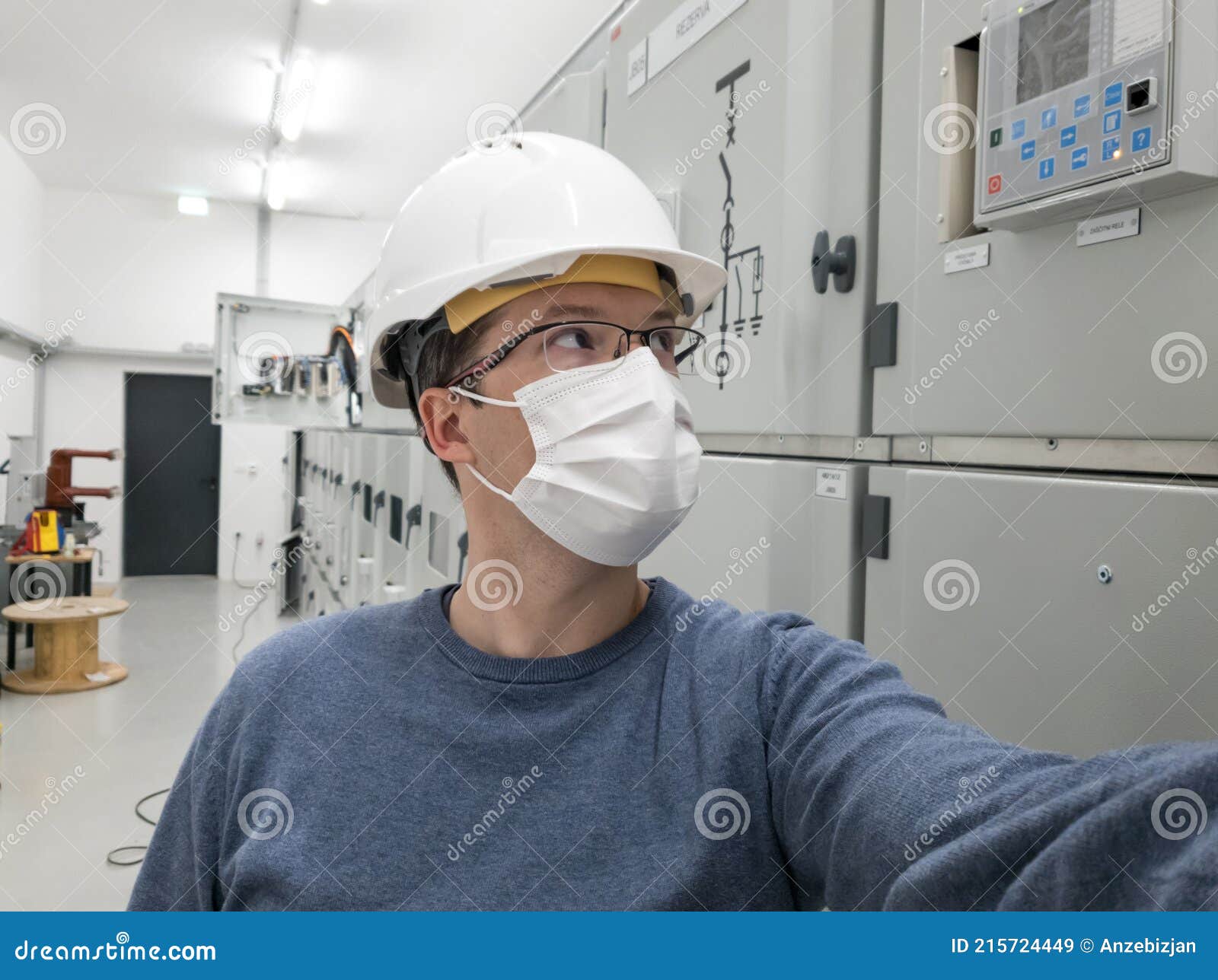 Young Engineer Working in Electrical Substation Wearing a Face Mask ...