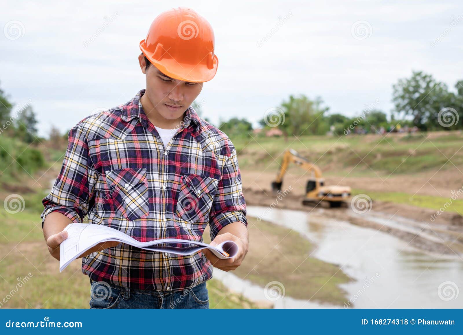 Young Engineer Working on Site at the Dam Stock Photo - Image of ...