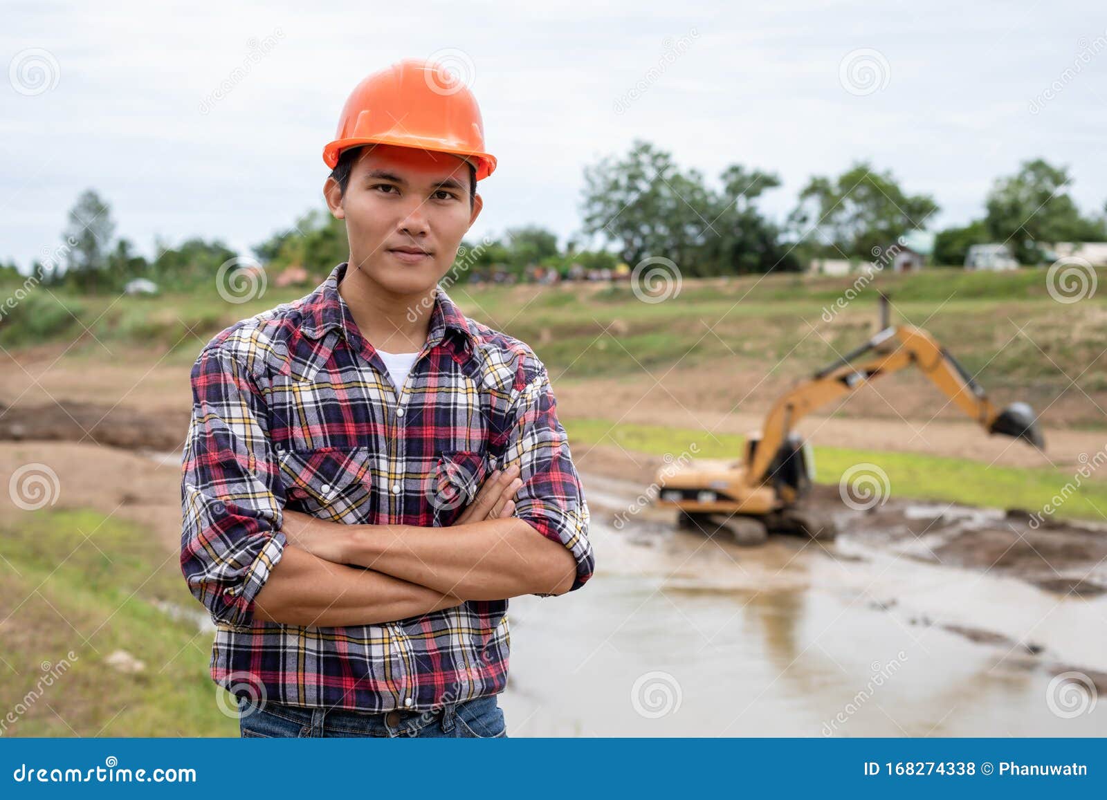 Young Engineer Working on Site at the Dam Stock Photo - Image of digger ...