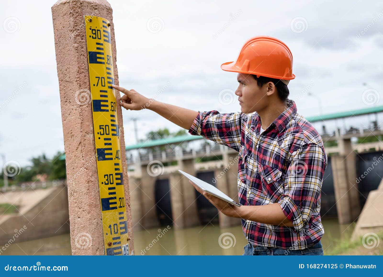 Young Engineer Working on Site at the Dam Stock Image - Image of ...