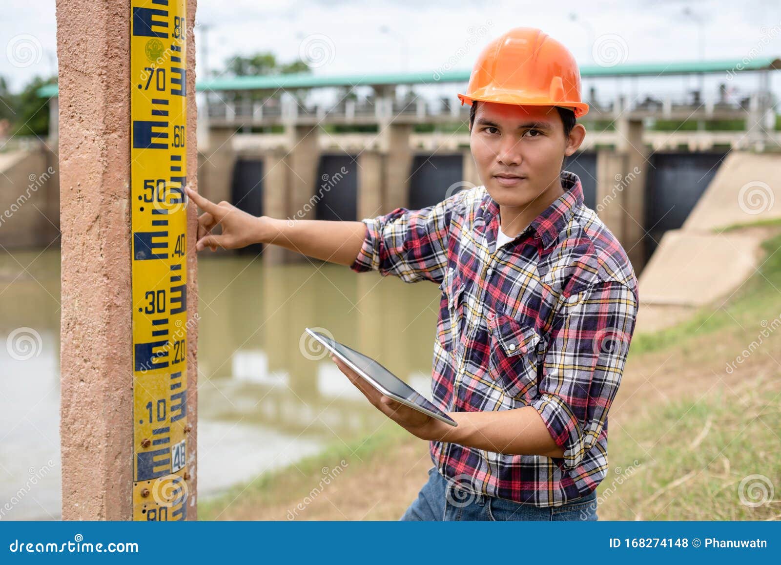 Young Engineer Working on Site at the Dam Stock Photo - Image of flood ...