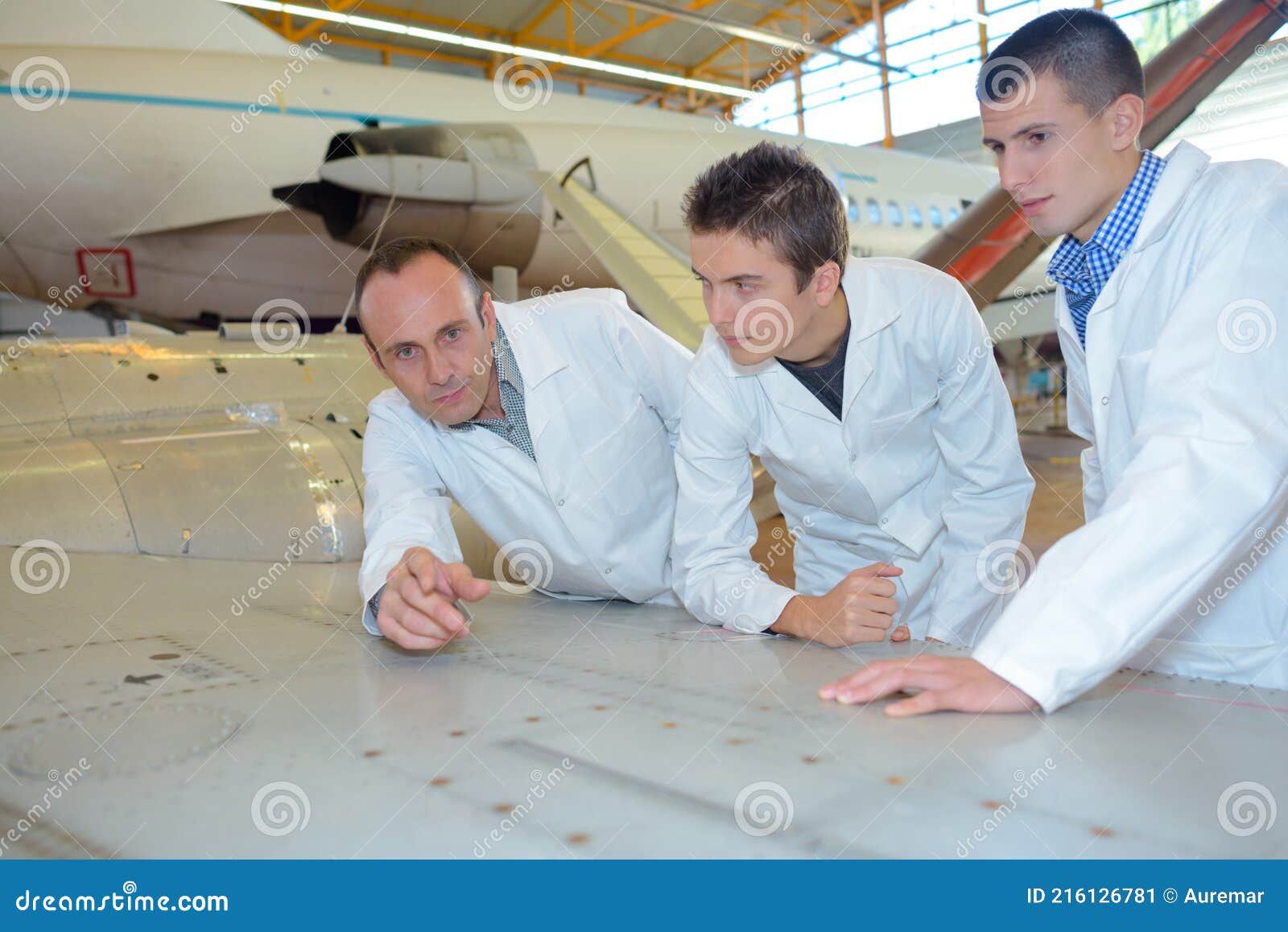 Young Engineers Check Aircraft Systems Stock Image - Image of widebody ...