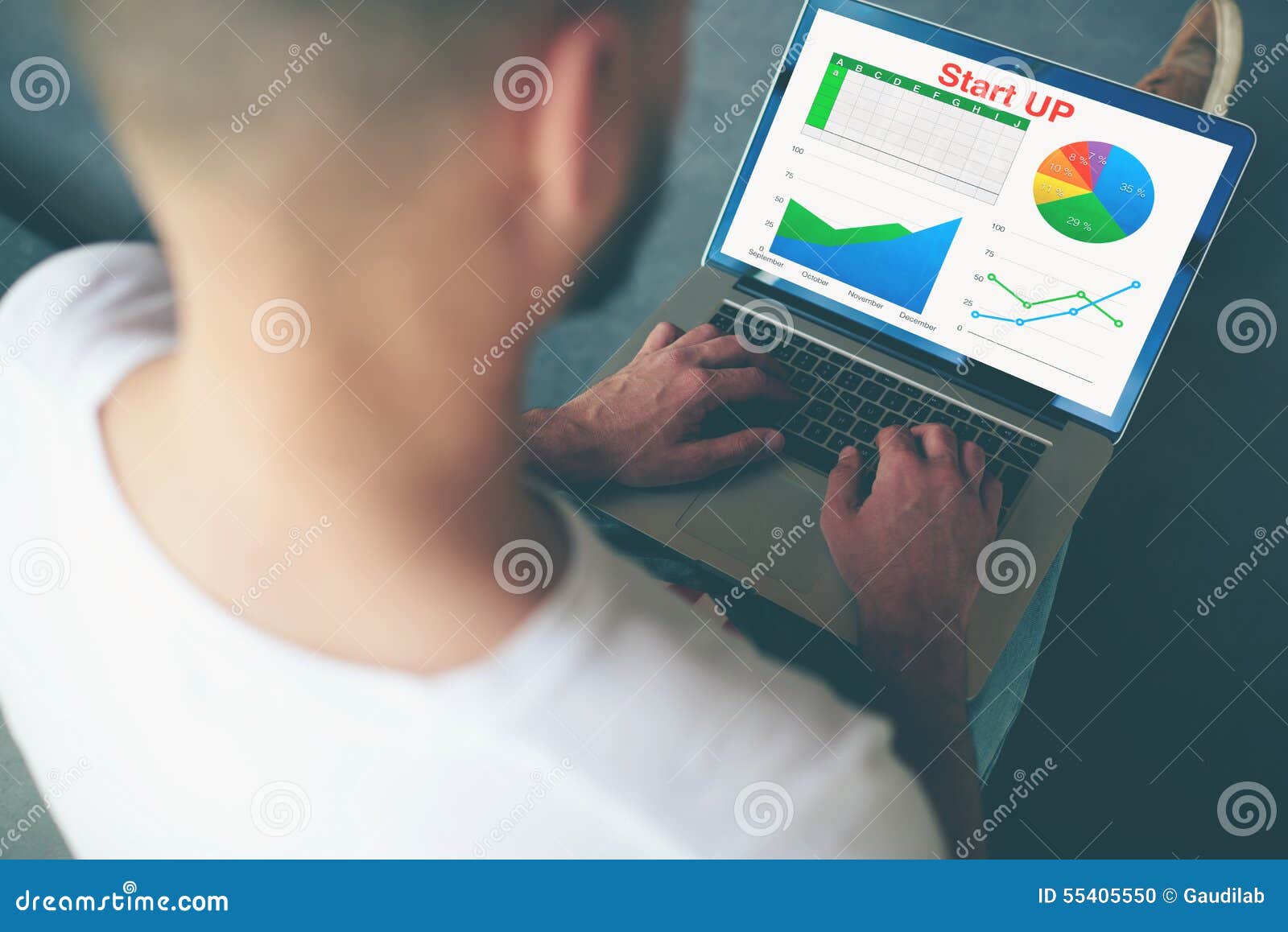 Young Entrepreneur Working with Statistics Data on Notebook Indoors ...
