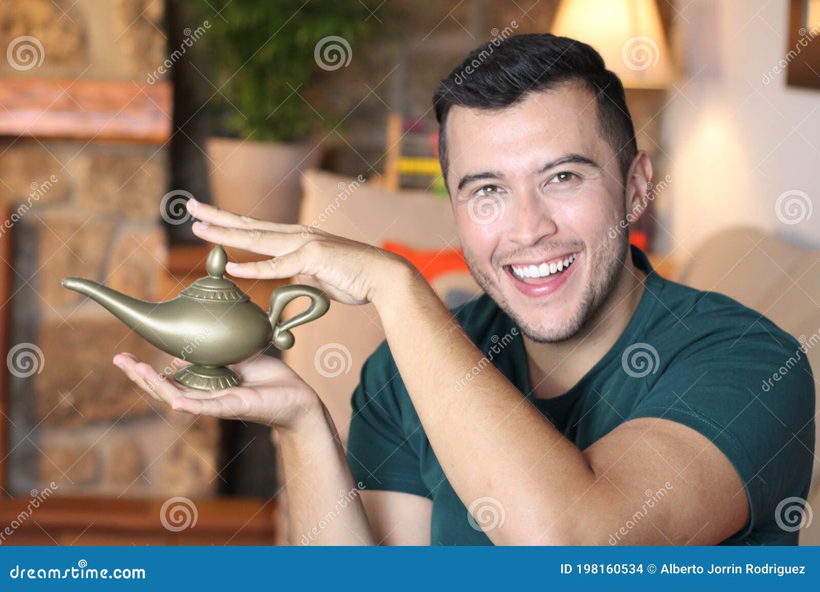 Young Ethnic Man Holding Genie Lamp Stock Photo - Image of islam ...