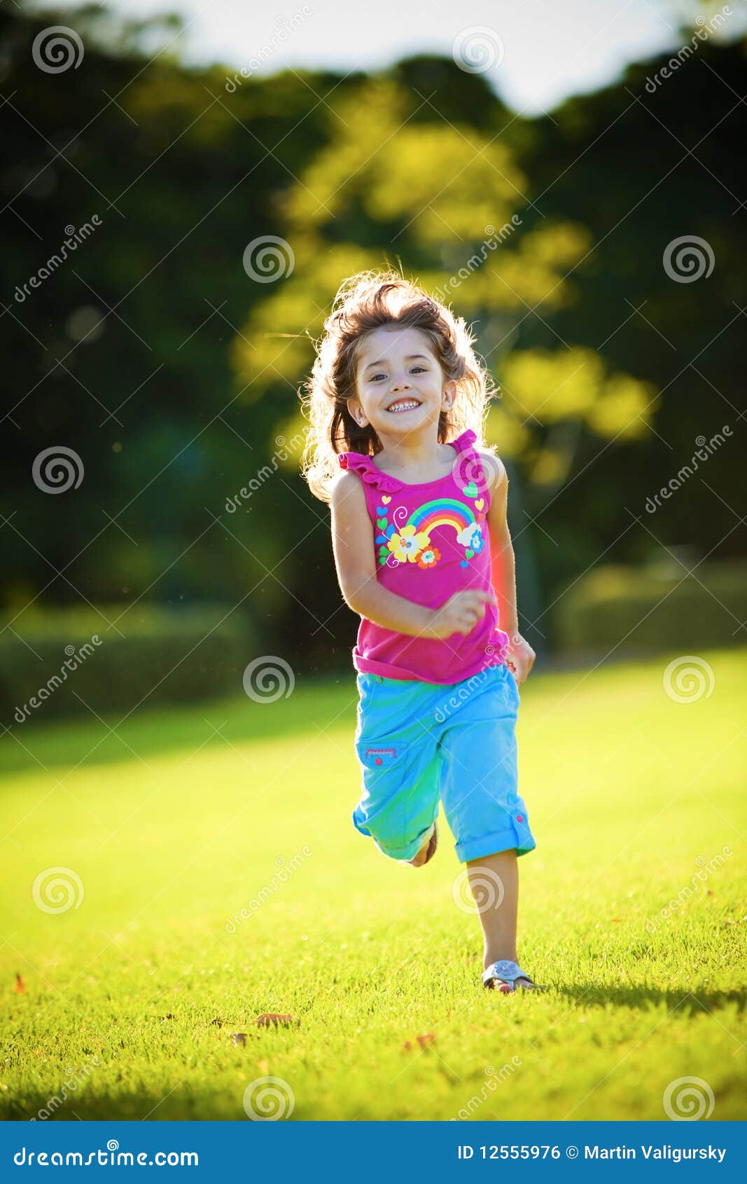 Young Excited and Smiling Girl Running Stock Photo - Image of green ...