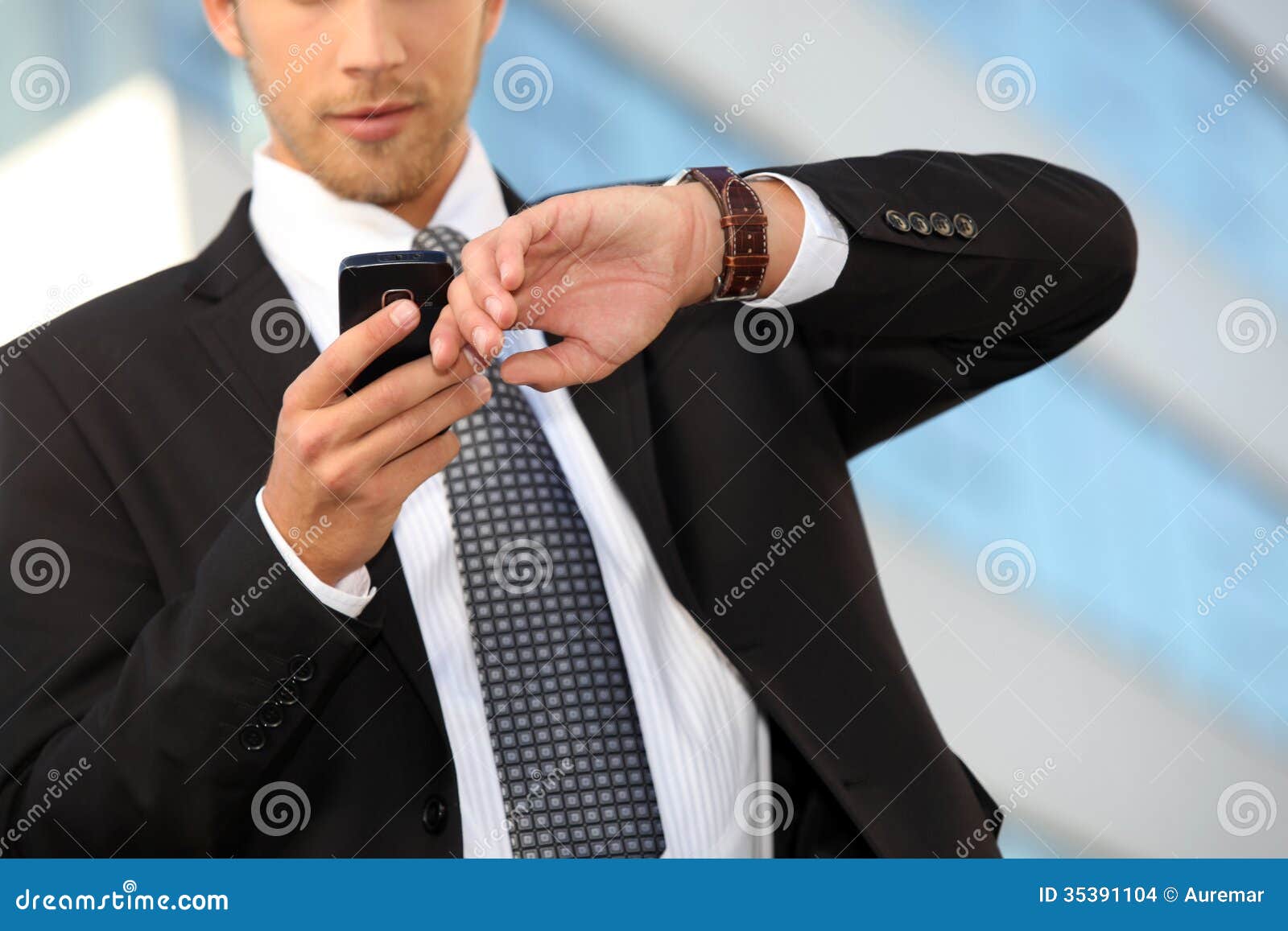 Young Executive Checking His Watch Stock Photo - Image of businessman ...