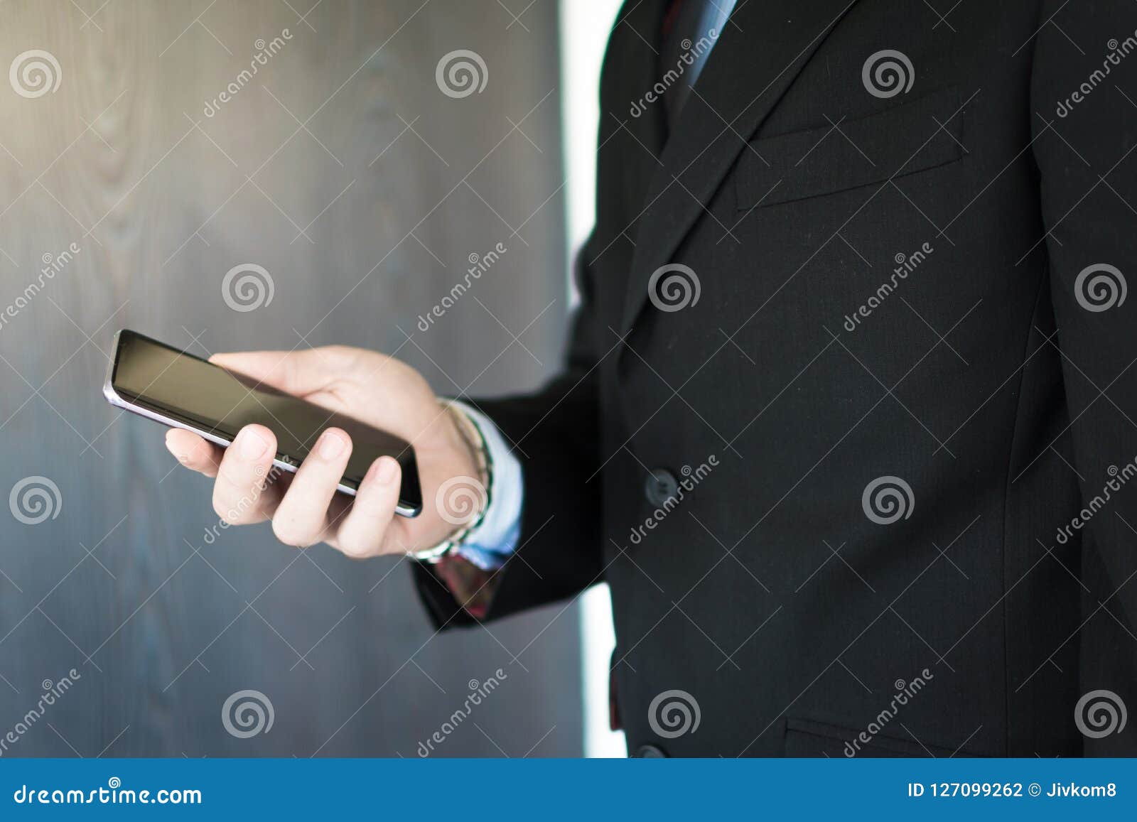 A Young Executive Working on His Mobile Phone Stock Photo - Image of ...