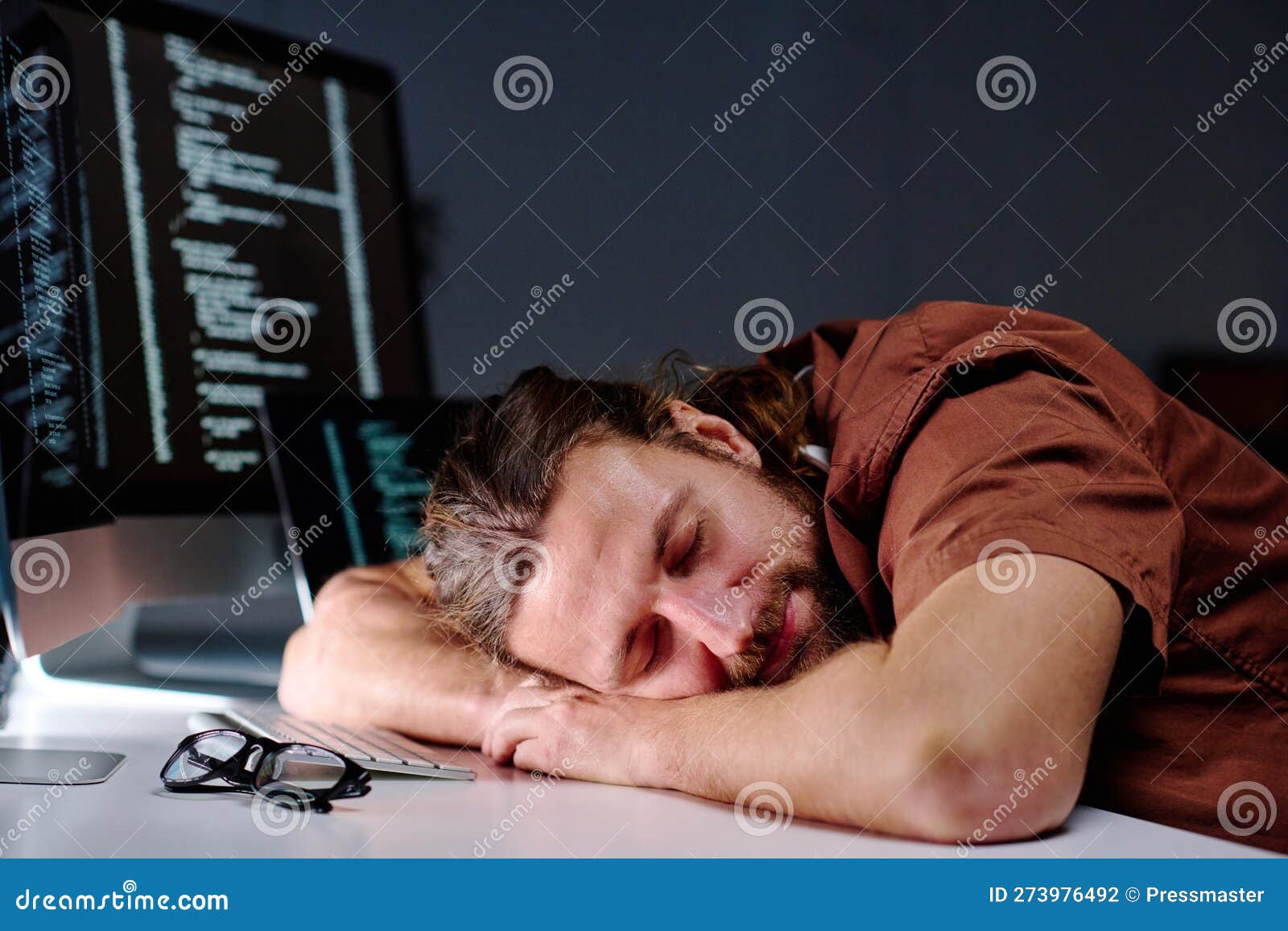 Young Exhausted Male Programmer with His Head on Desk Sleeping after ...