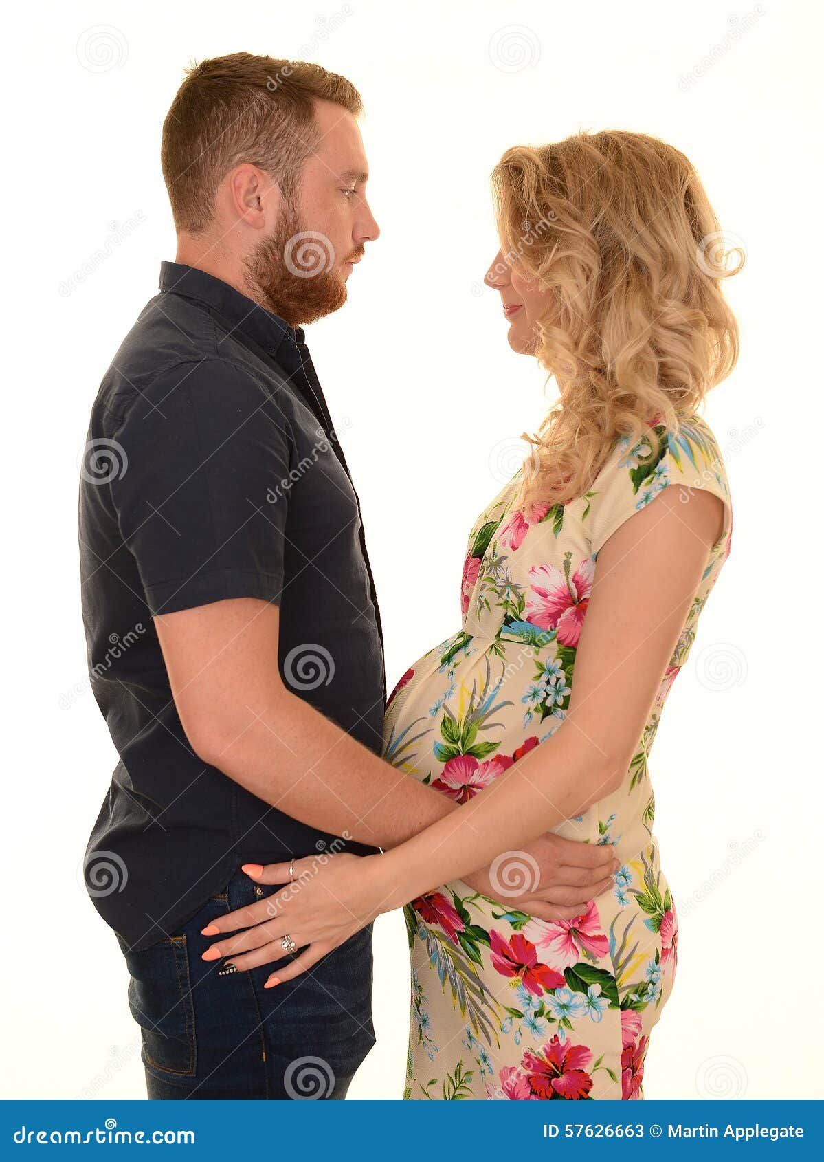 Young Expecting Parents Standing By A Crib Stock Photo | CartoonDealer ...