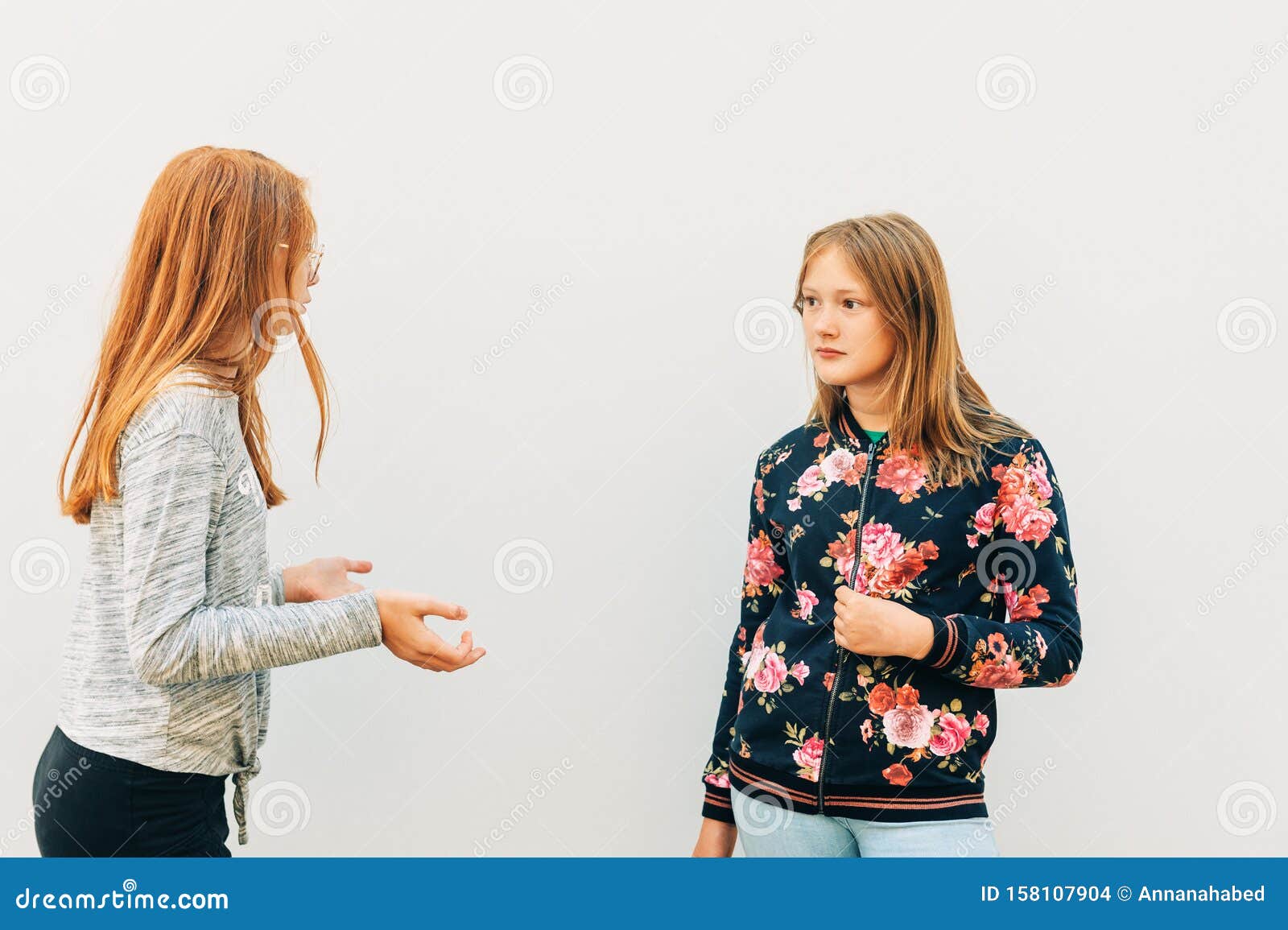 Young Expressive Girls Having Active Conversation Stock Photo - Image ...