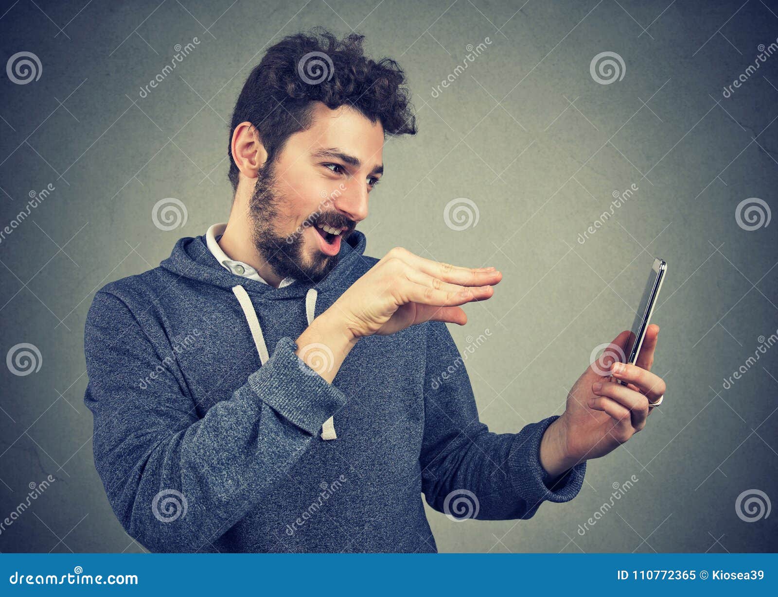 Man Manipulating with Smarpthone and Gesturing Stock Image - Image of ...