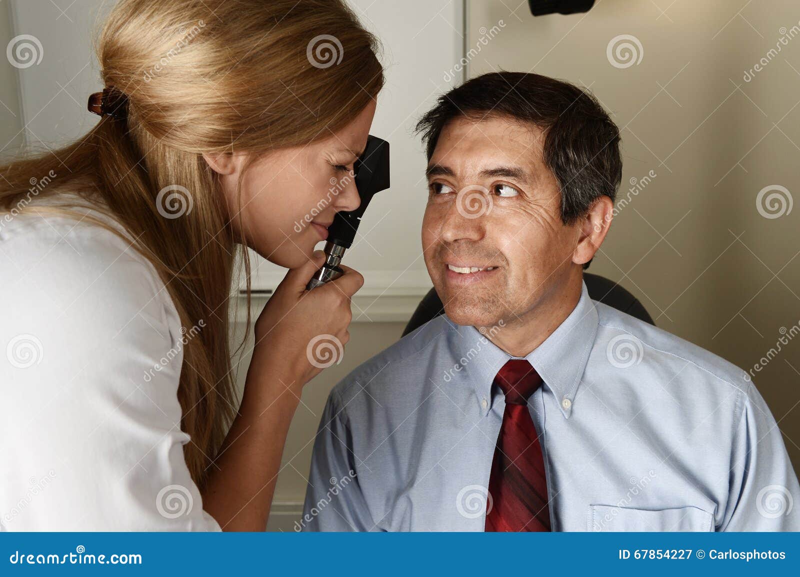 Young Eye Doctor during a Patient Examination Stock Image - Image of ...