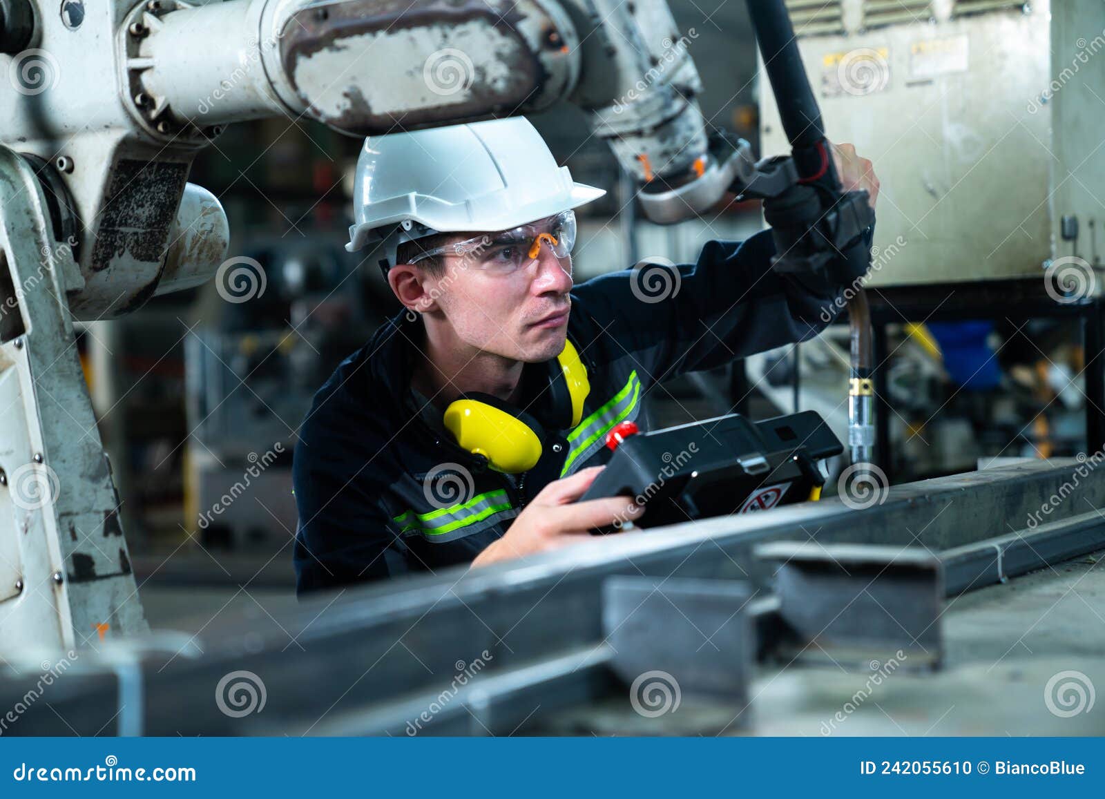 Young Factory Worker Working with Adept Robotic Arm Stock Photo - Image ...