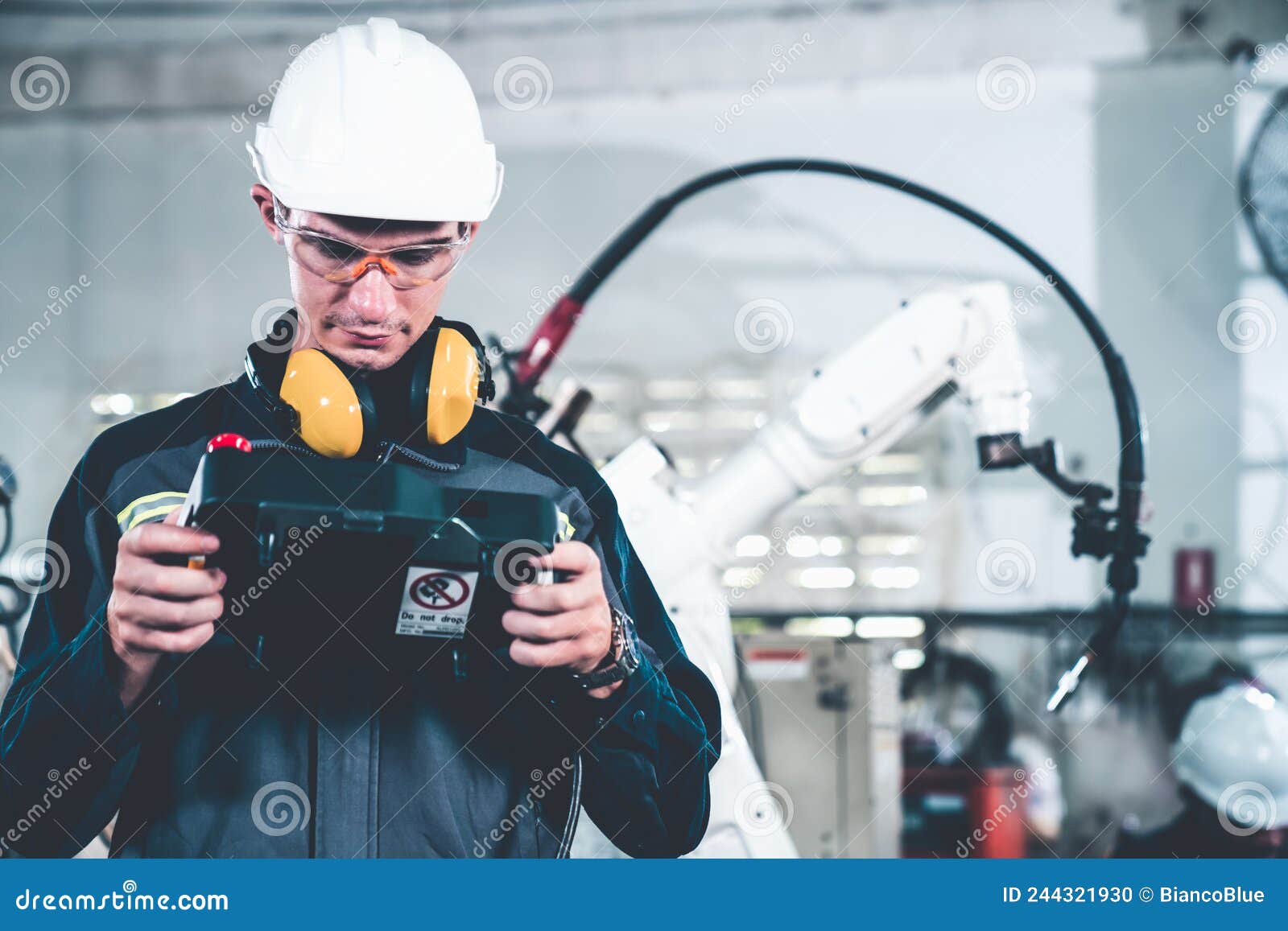 Young Factory Worker Working with Adept Robotic Arm Stock Photo - Image ...
