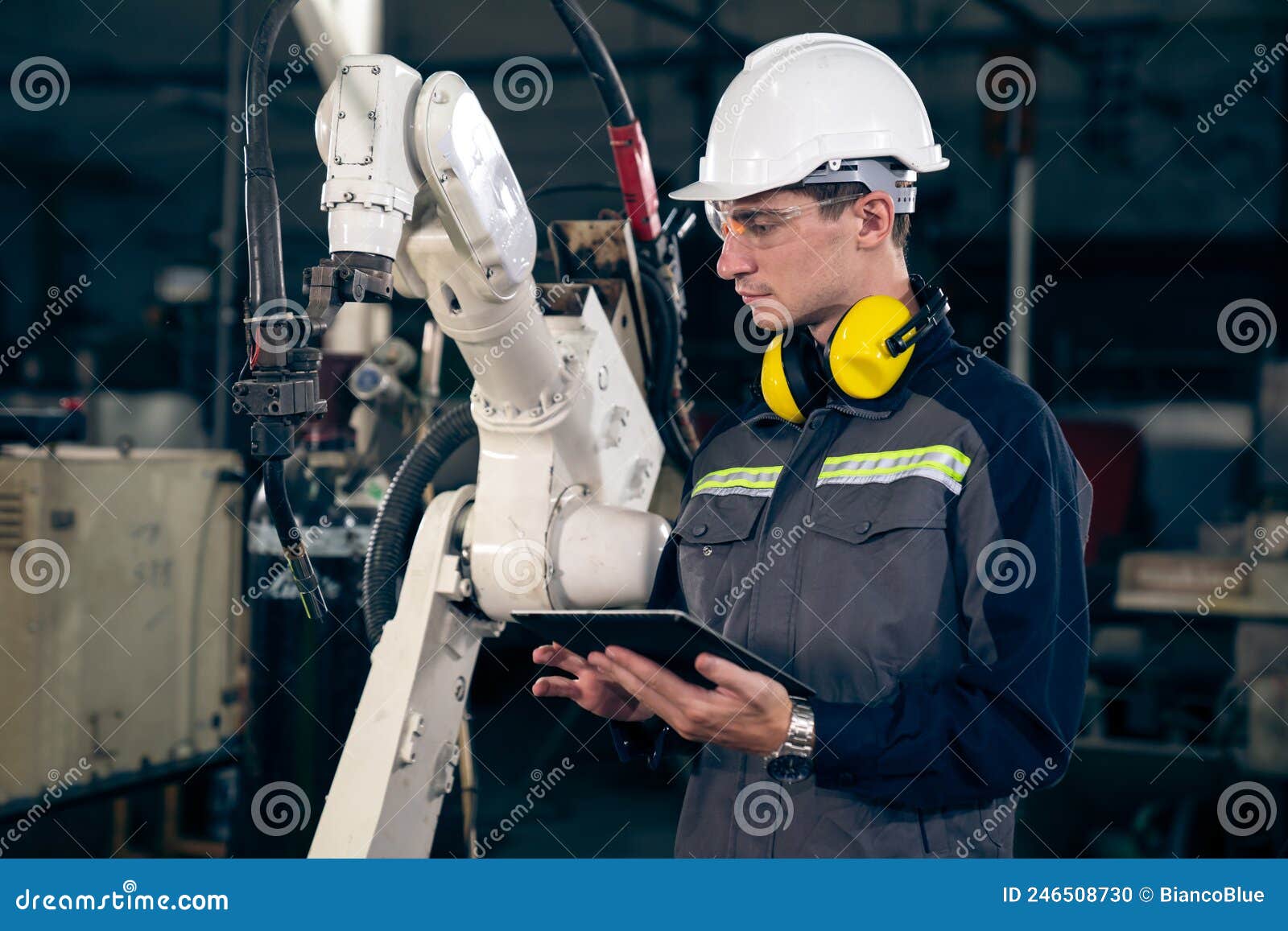 Young Factory Worker Working with Adept Robotic Arm Stock Photo - Image ...