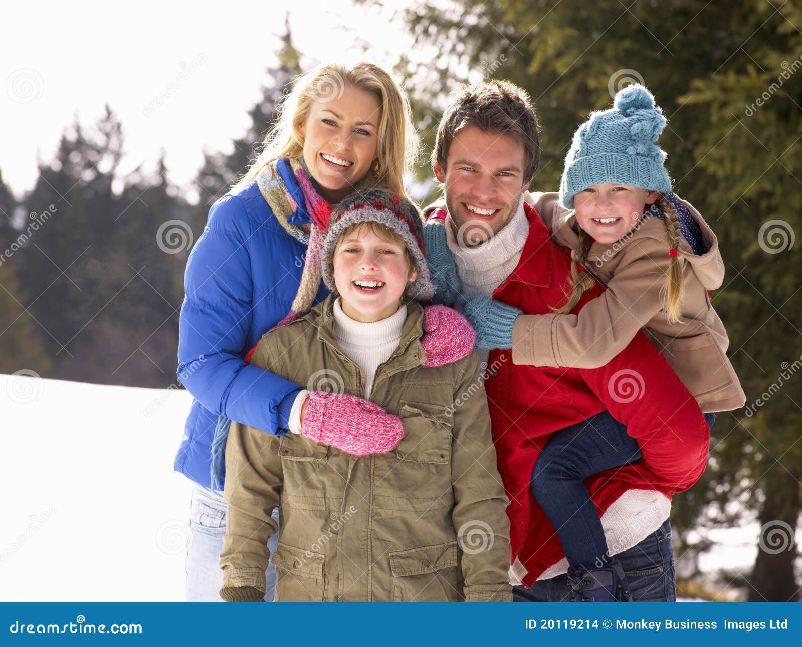 Young Family in Alpine Snow Scene Stock Photo - Image of smiling, girl ...