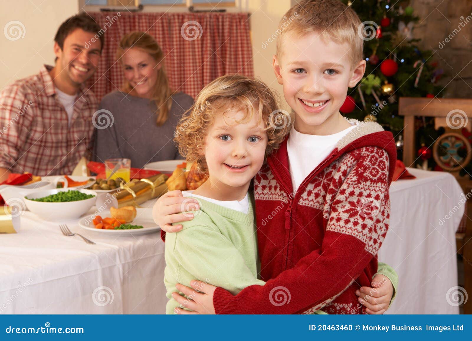 Young Family at Christmas Dinner Table Stock Photo - Image of enjoying ...