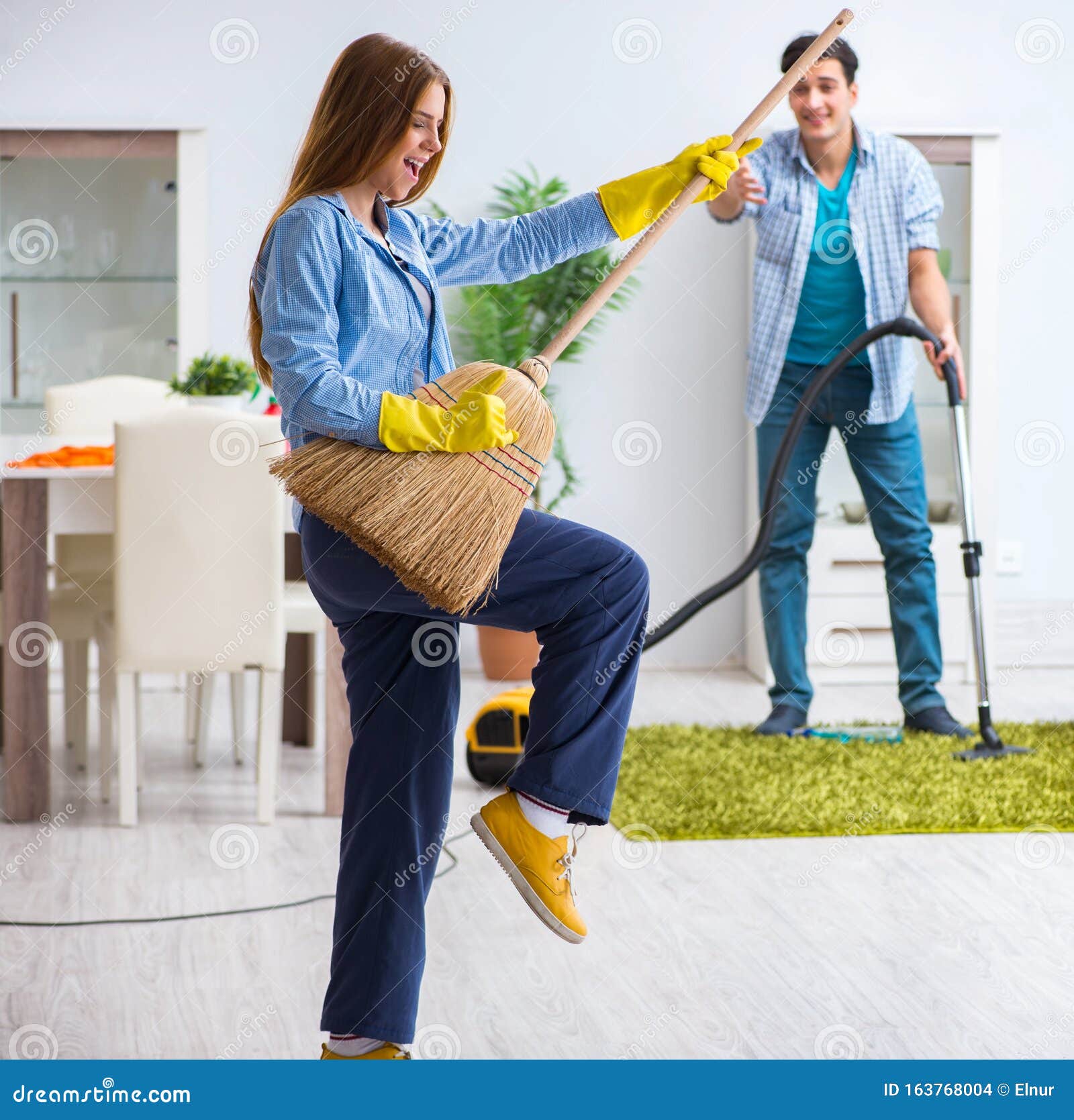 Young Family Cleaning the House Stock Photo - Image of husband, maid ...