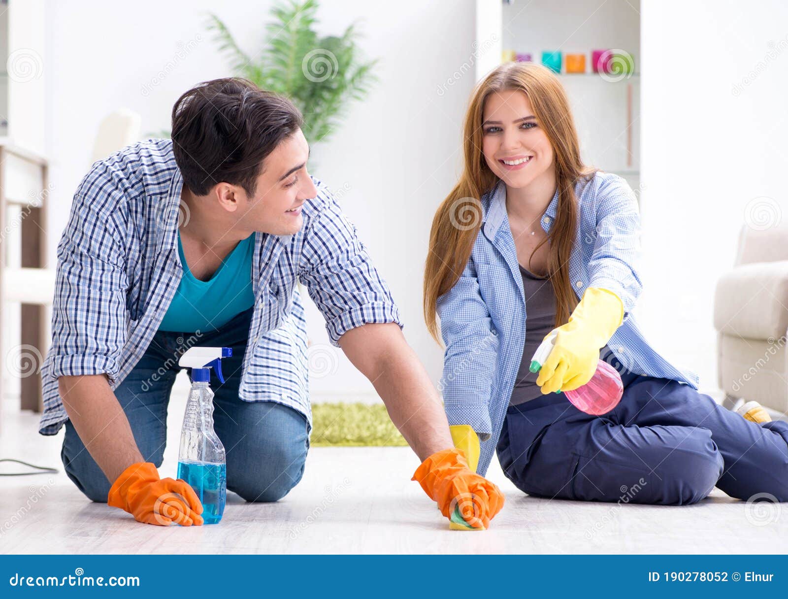 Young Family Cleaning the House Stock Photo - Image of bottle, duster ...