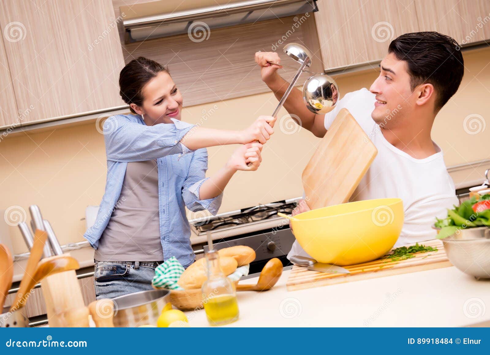 The Young Family Doing Funny Fight at Kitchen Stock Photo - Image of ...