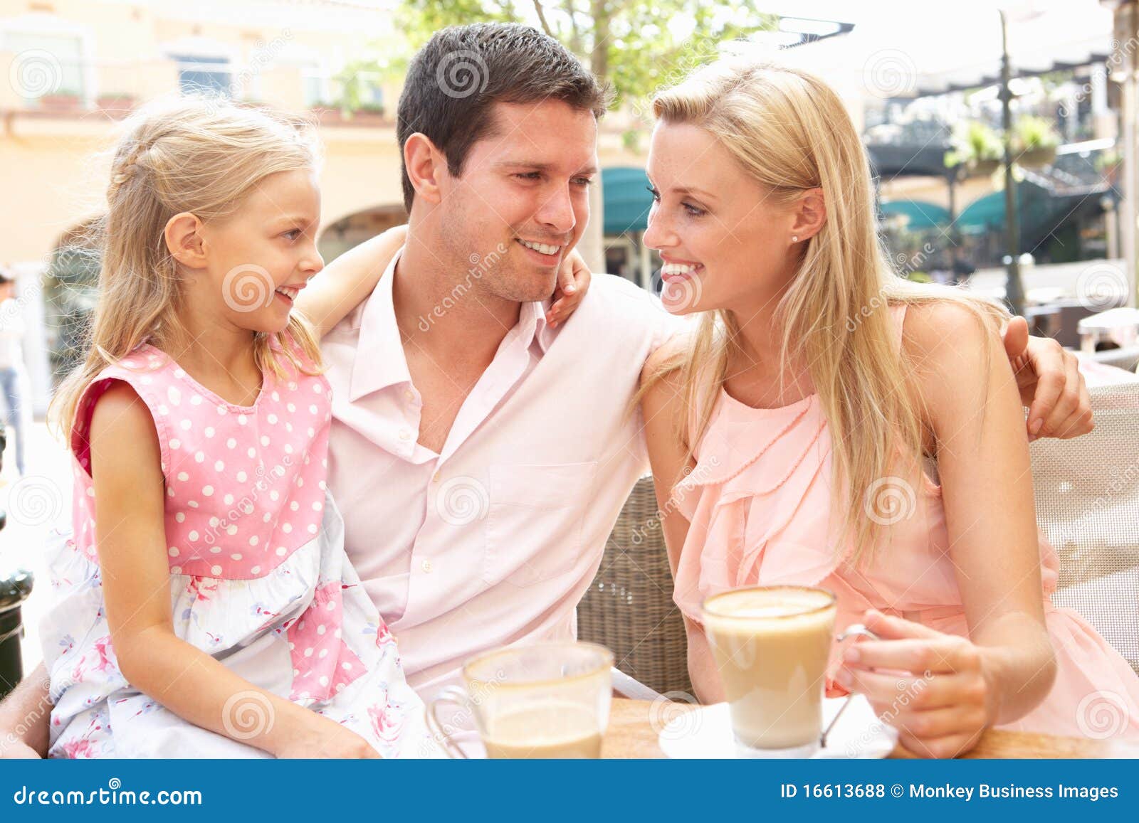 Young Family Enjoying Cup of Coffee Stock Photo - Image of outside ...