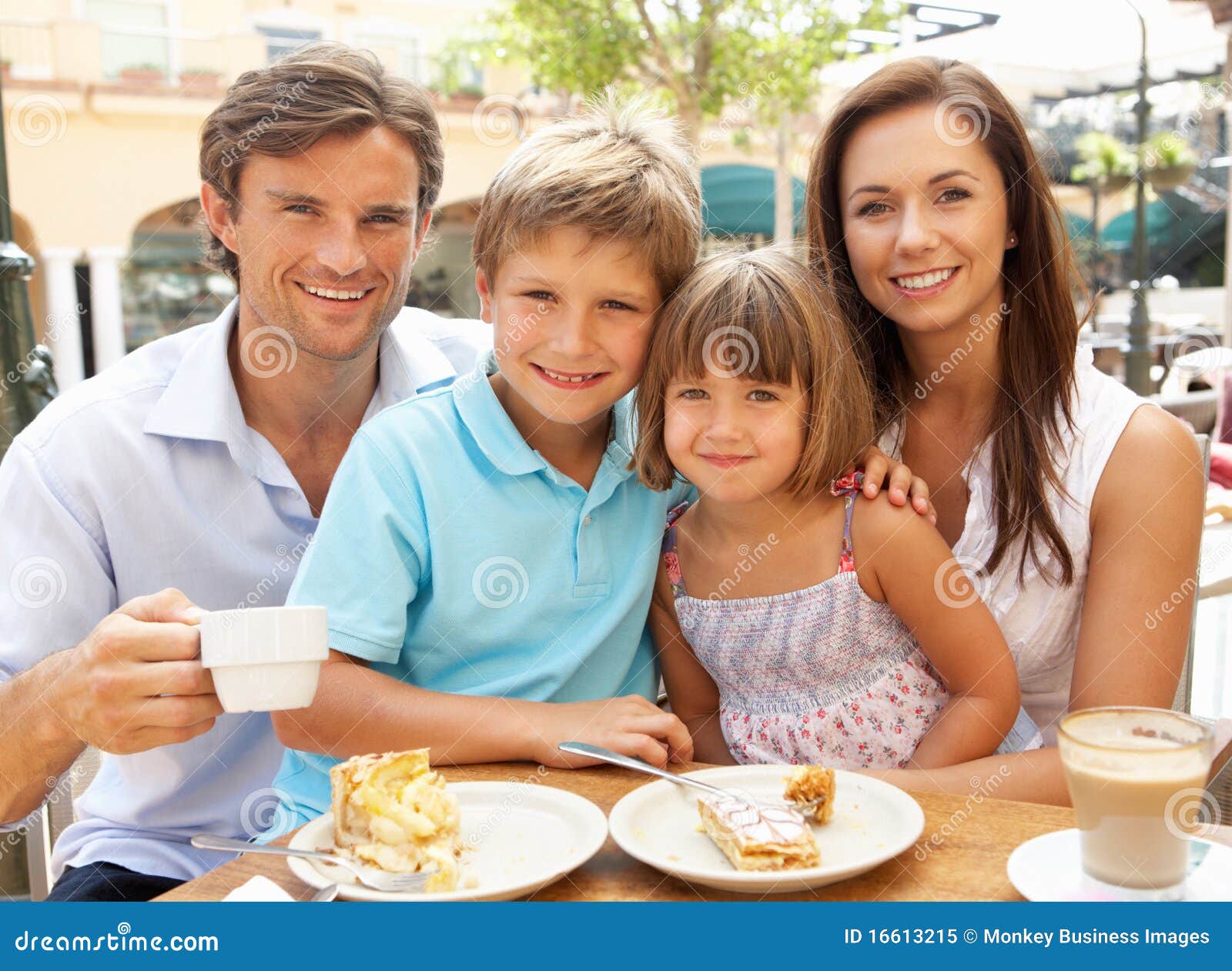 Young Family Enjoying Cup of Coffee and Cake Stock Image - Image of ...