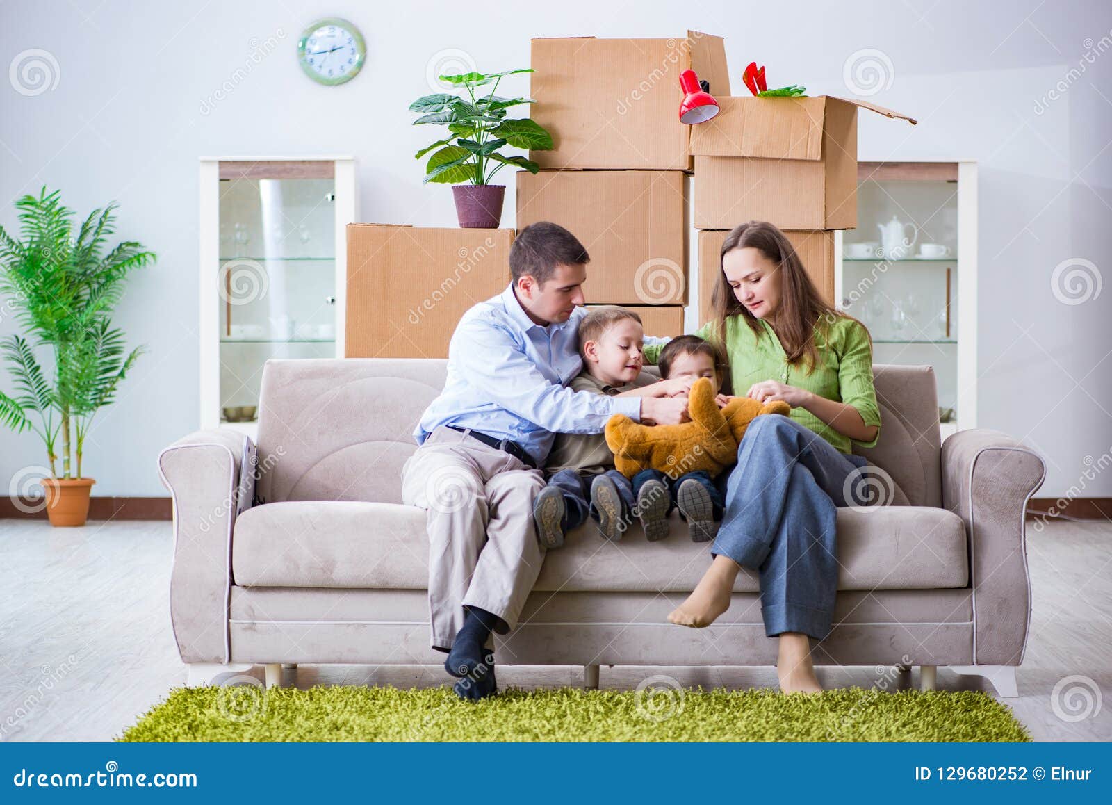 The Young Family Enjoying Time at Home Stock Photo - Image of boxes ...